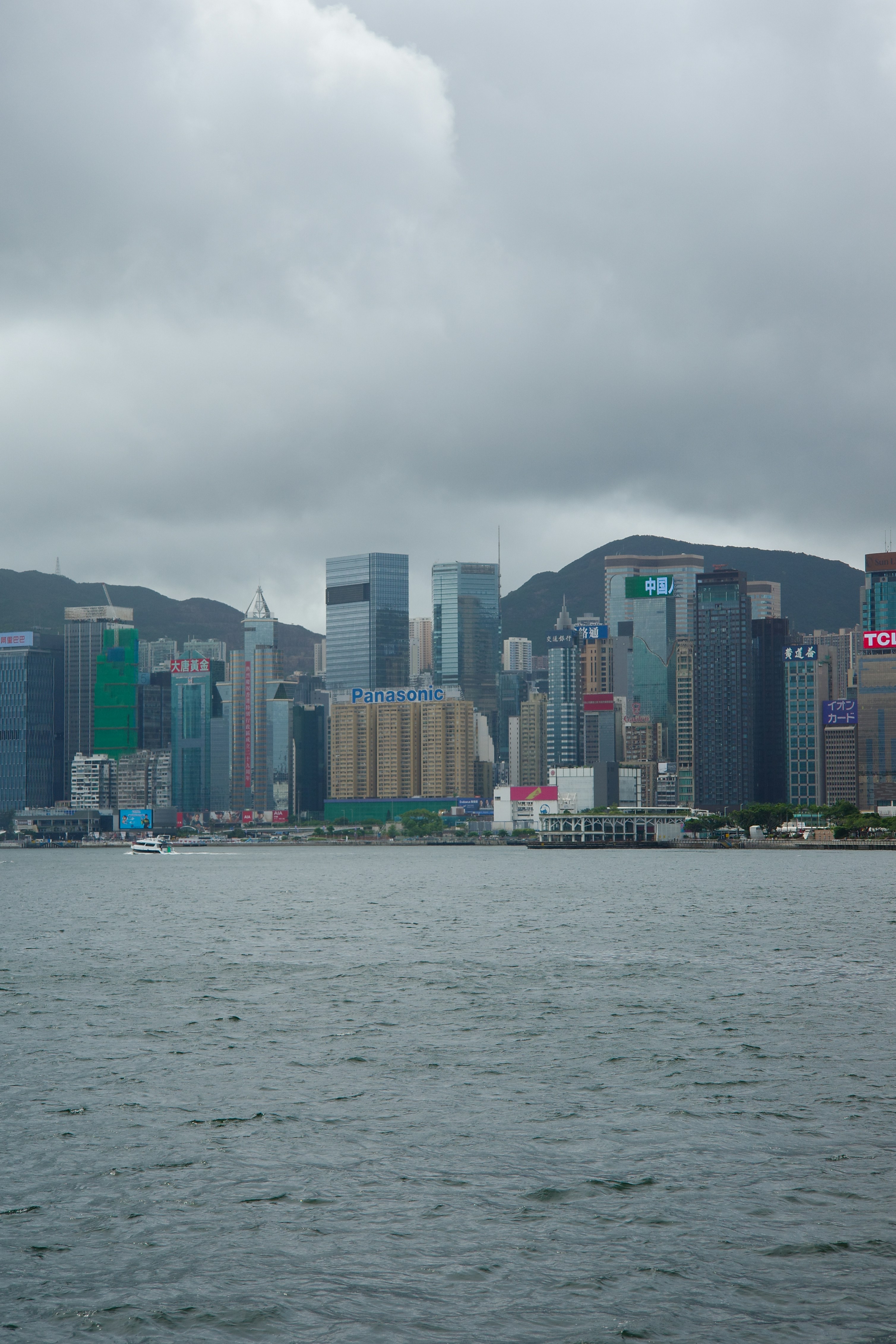 Harbor of Glass and Steel: City Skyline Over Puget-like Waters