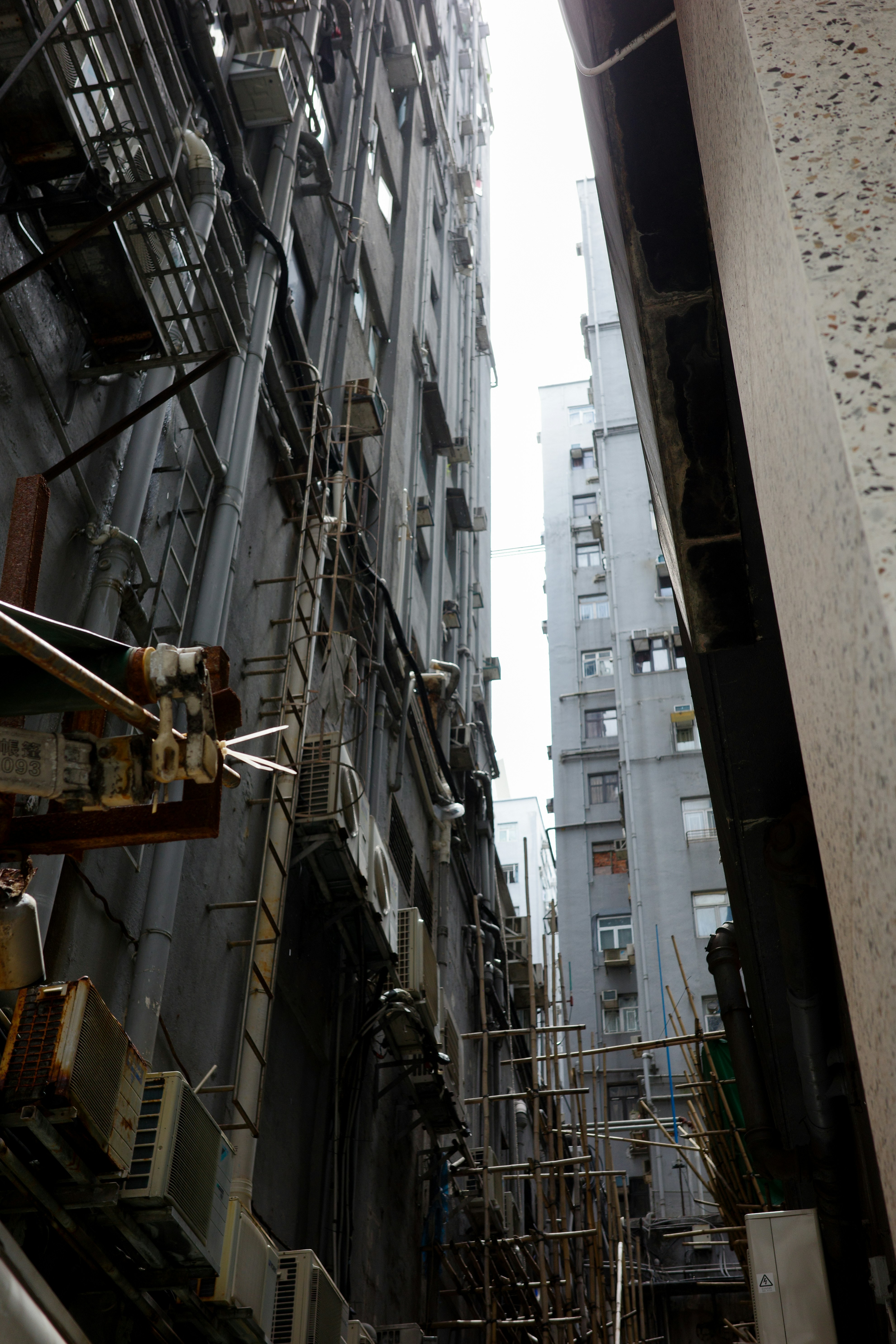 Narrow Skyward Gap Between Rust and Concrete