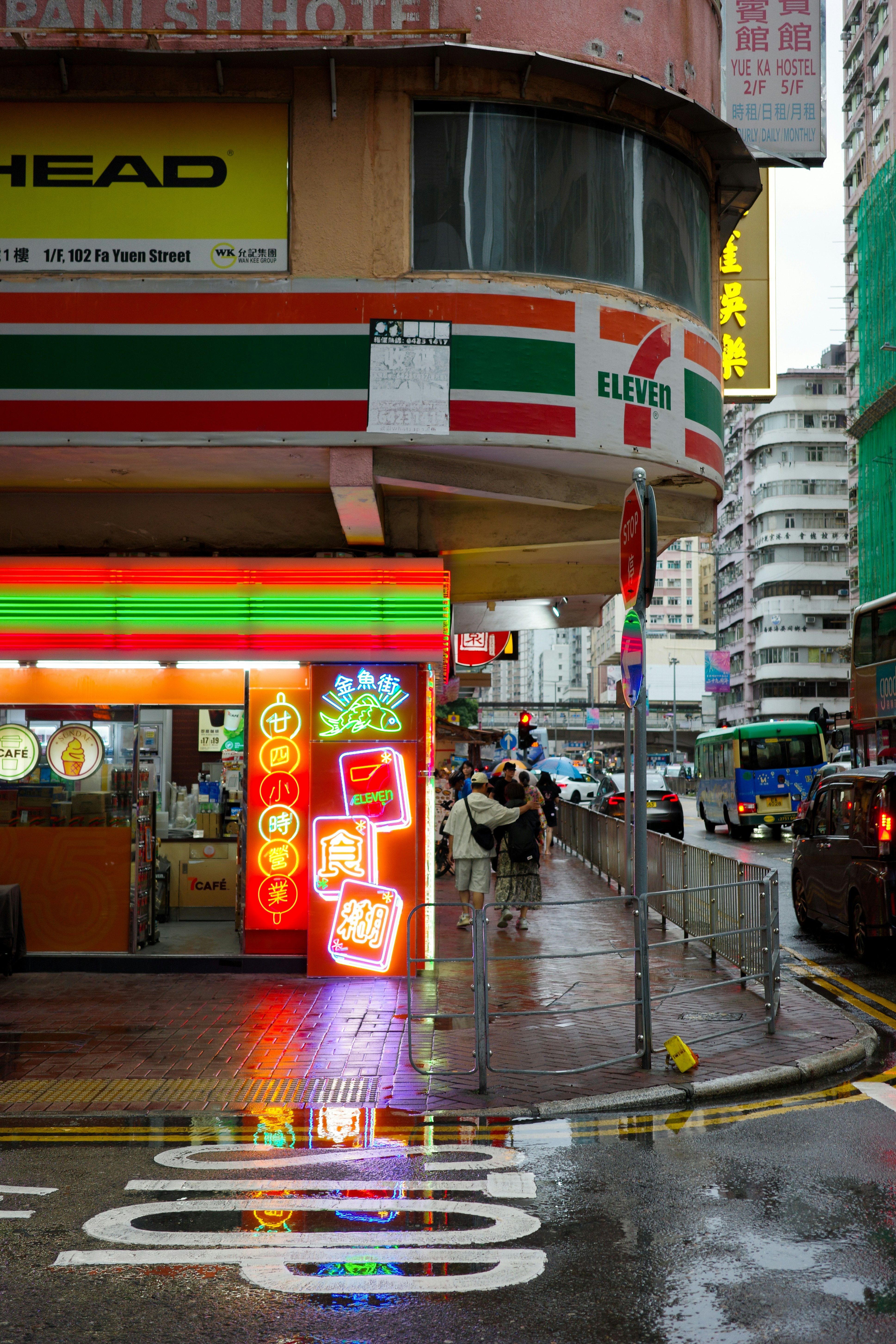Neon Corridor: A Rainy Street Near a 7-Eleven Jewel