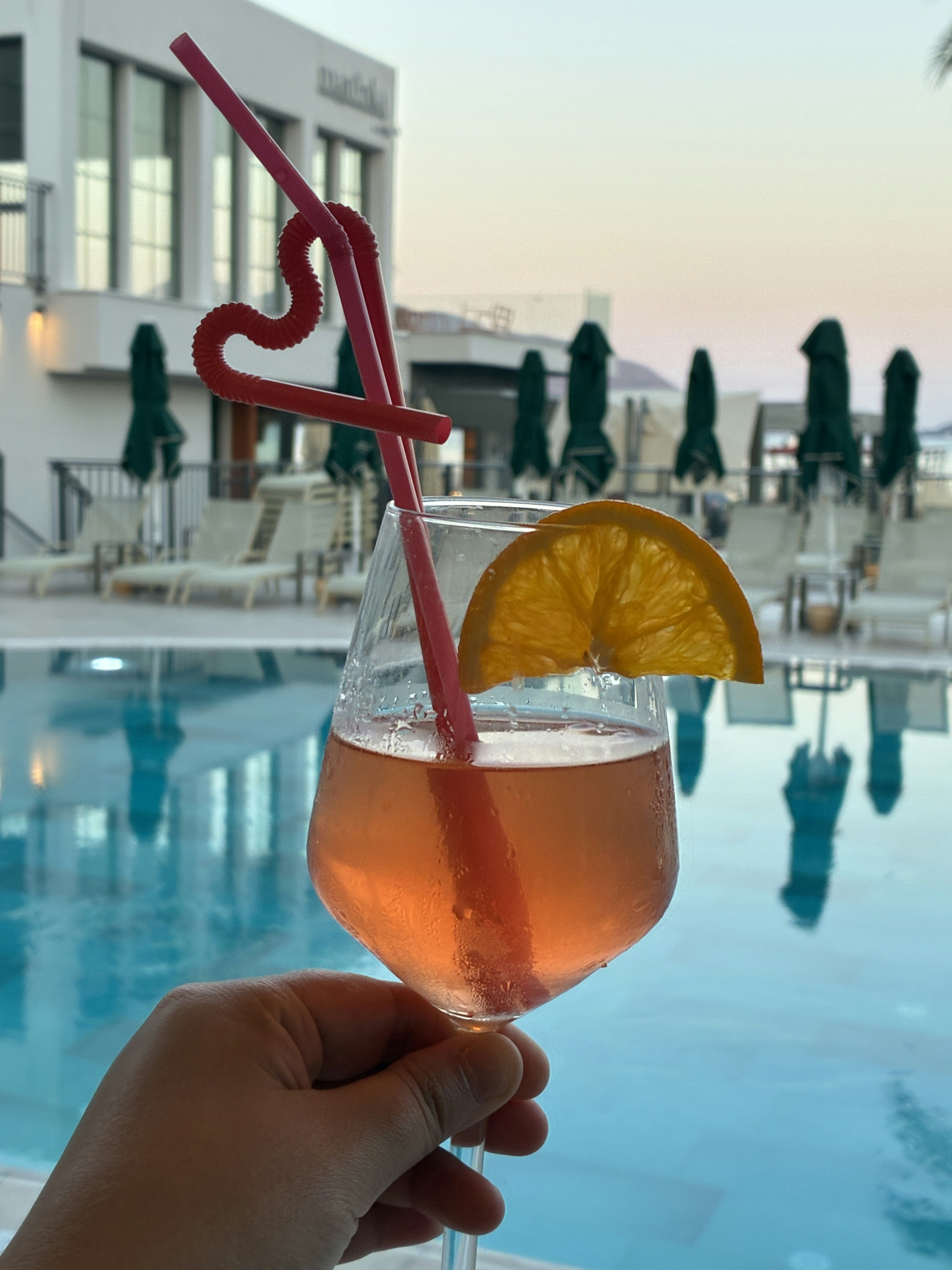 Sunset Sip: A Carafe of Orange by the Pool