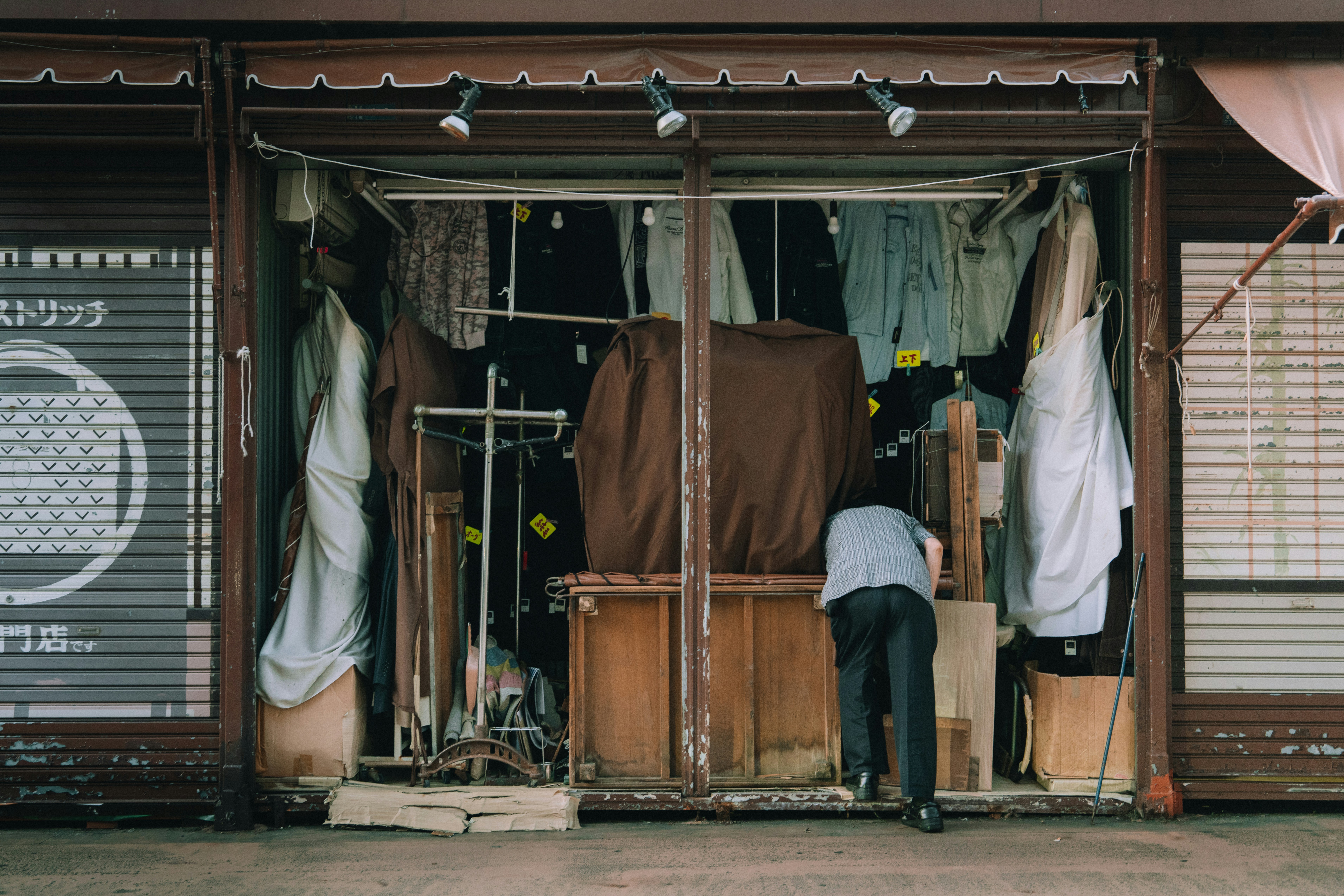 Hidden Workshop Unfolding Behind a Closed Shopfront