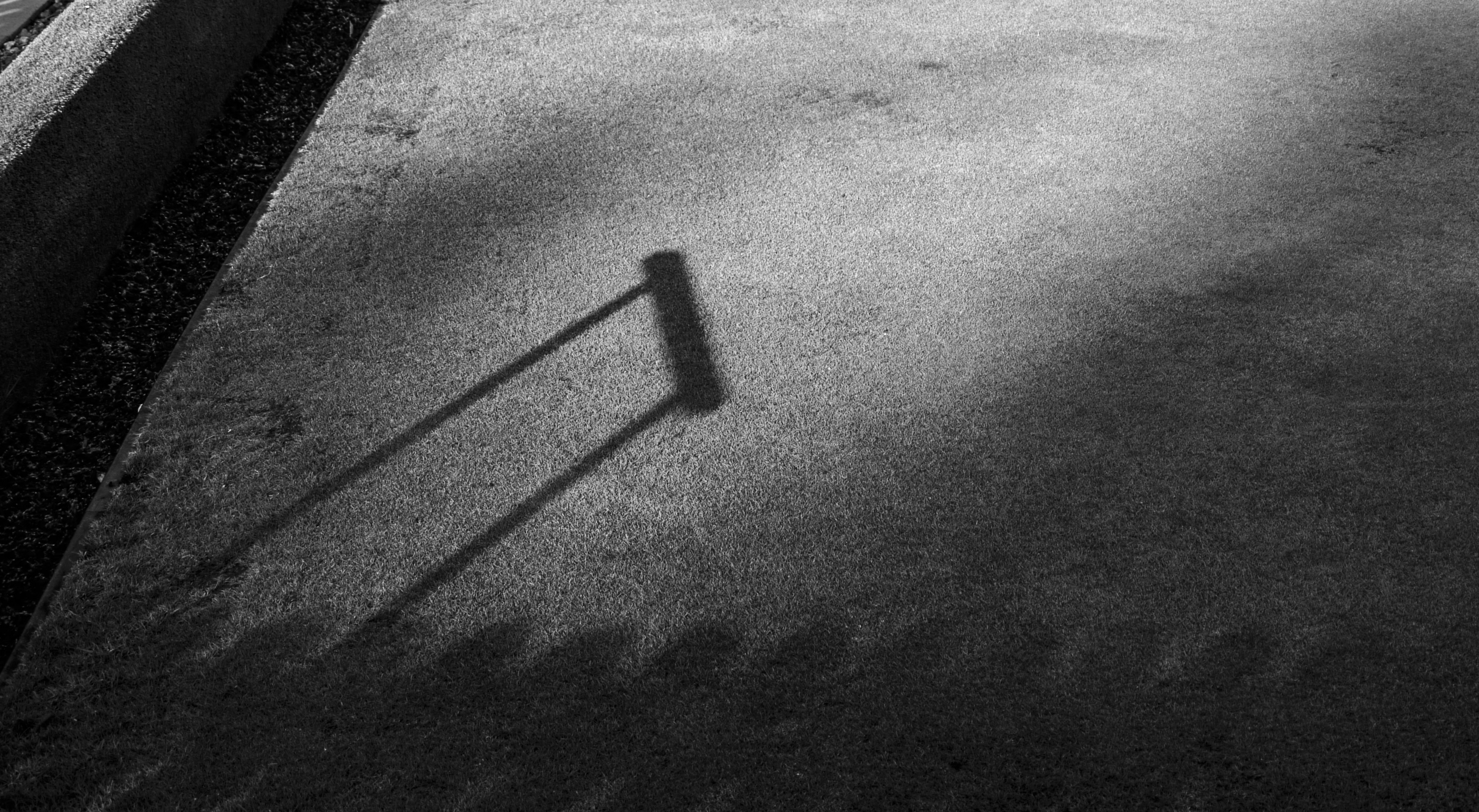 Shadowed Bent Rail: A Quiet Stairwell of Light and Noise