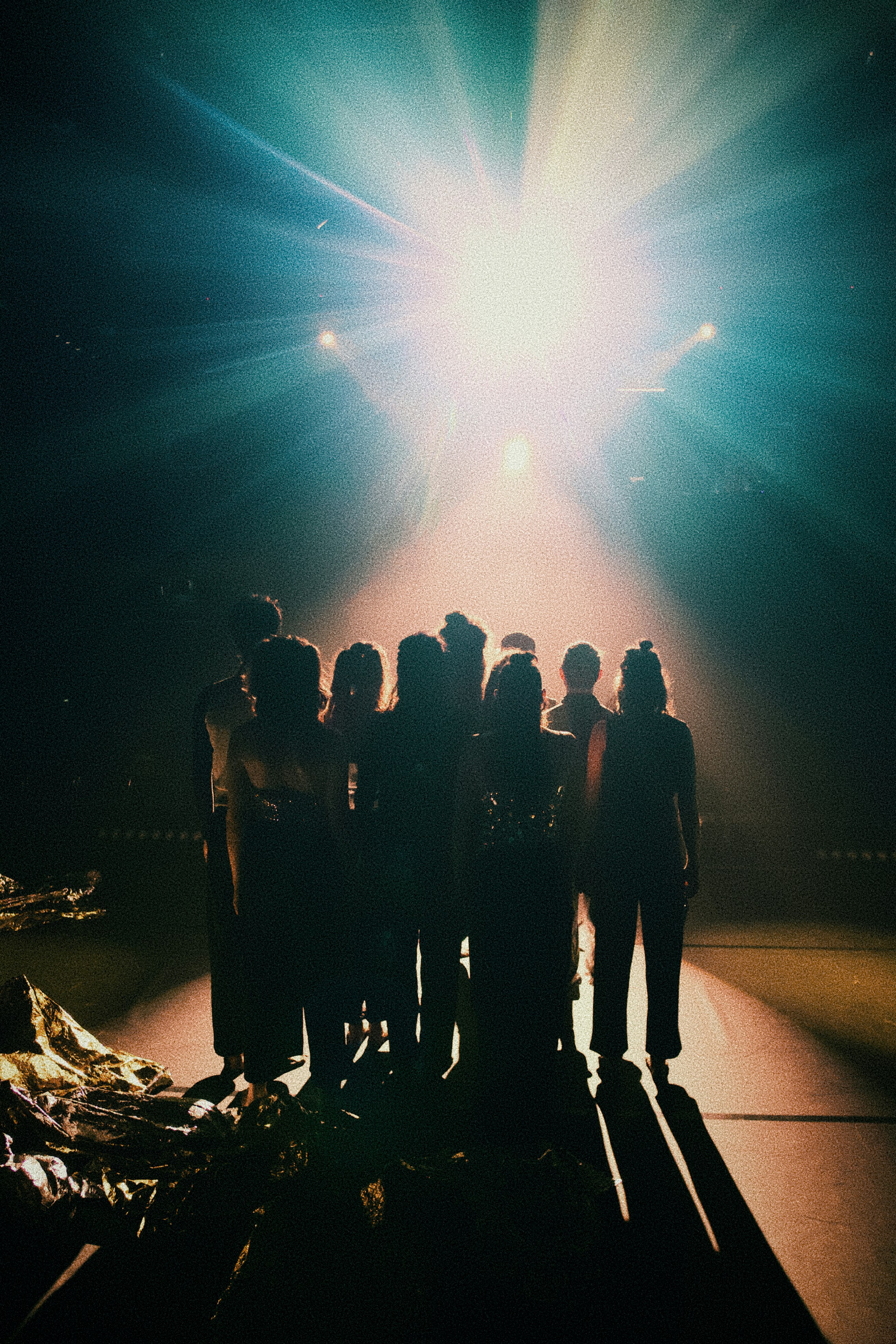 Silhouetted Ensemble under a Cosmic Spotlight