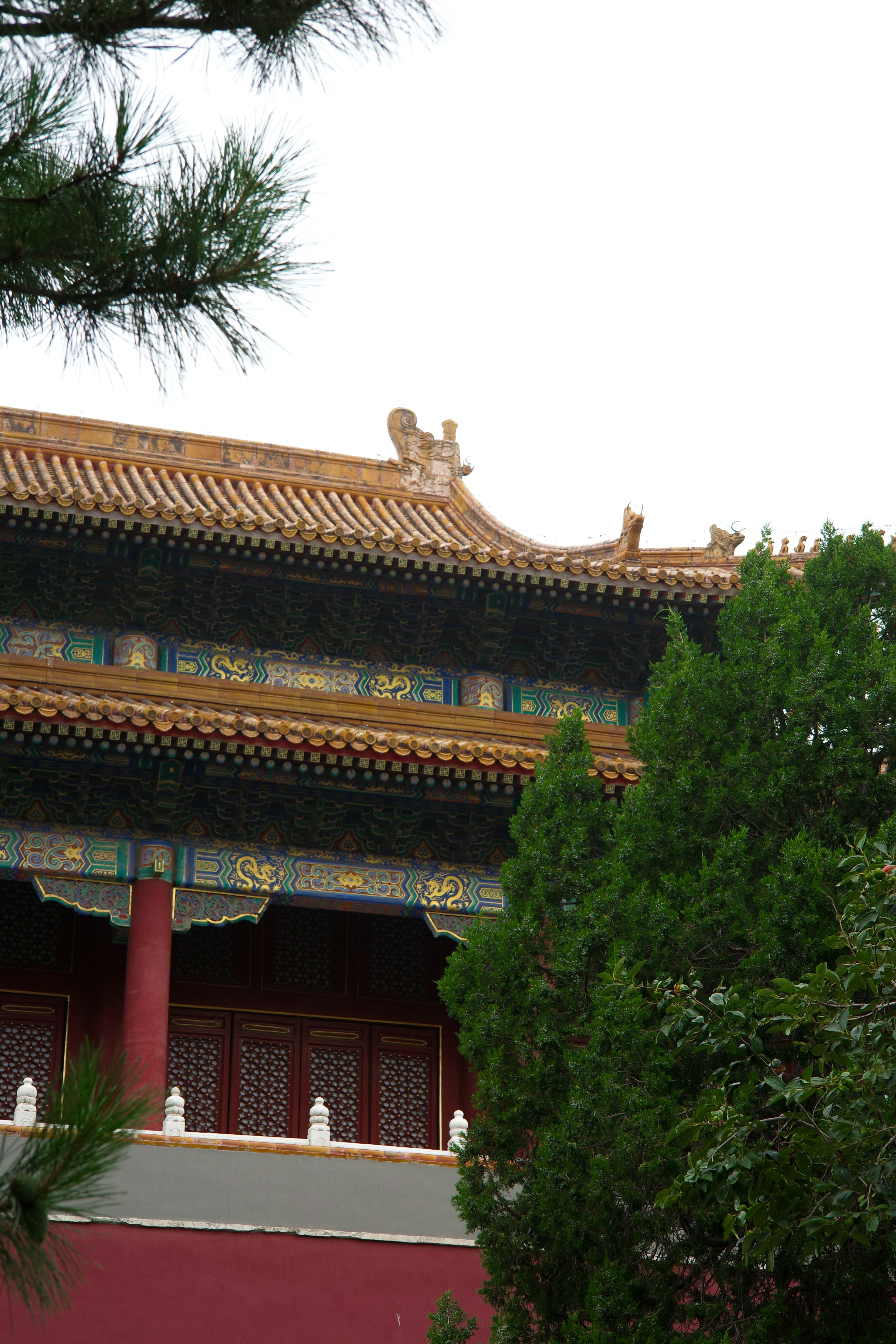 Temple Roof Lines and Copper Tiles under Green Foliage