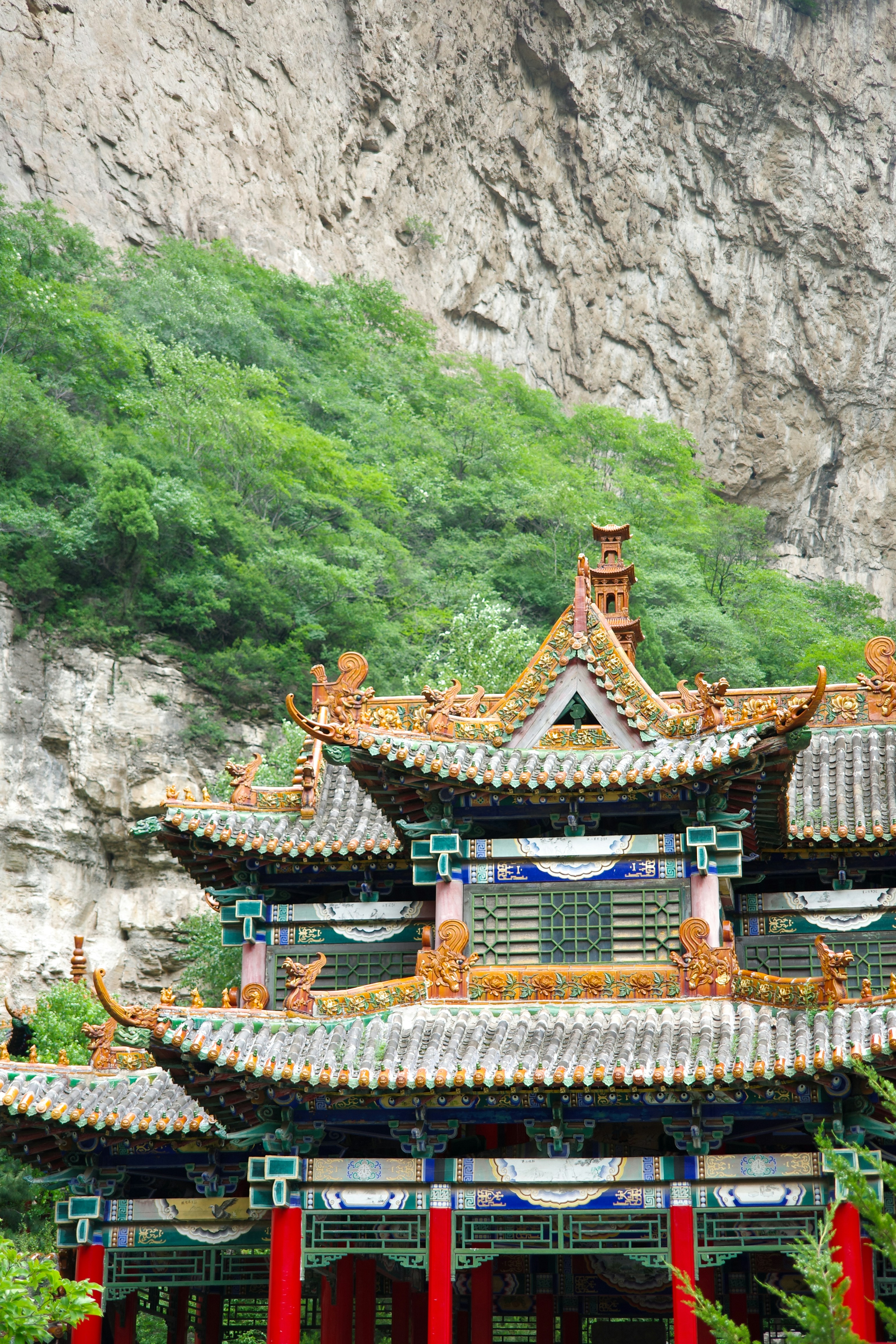 Temple Silhouette Amid Rockface: A Staircase of Colors