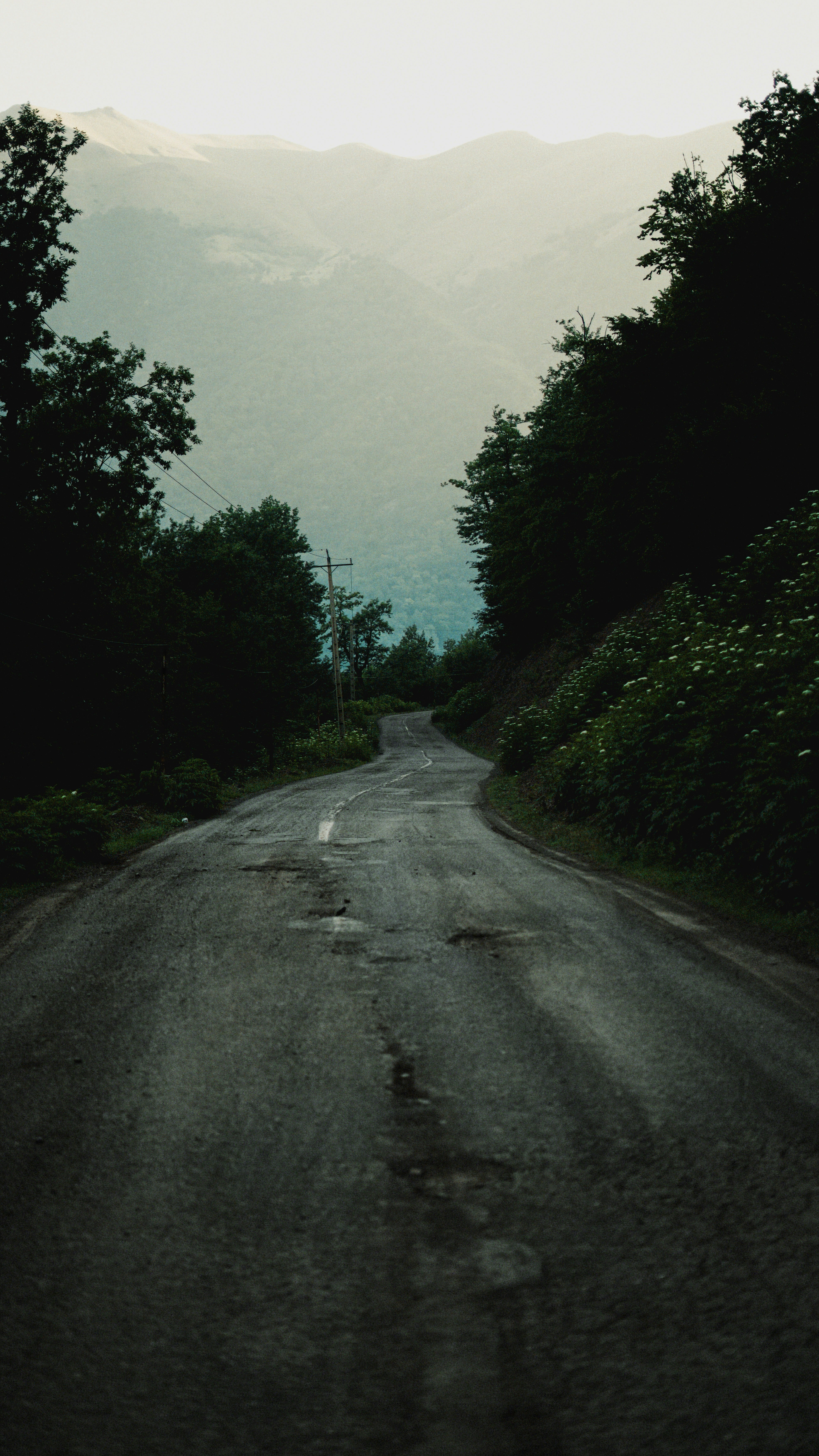 Winding Mountain Road Halting in a Quiet Valley