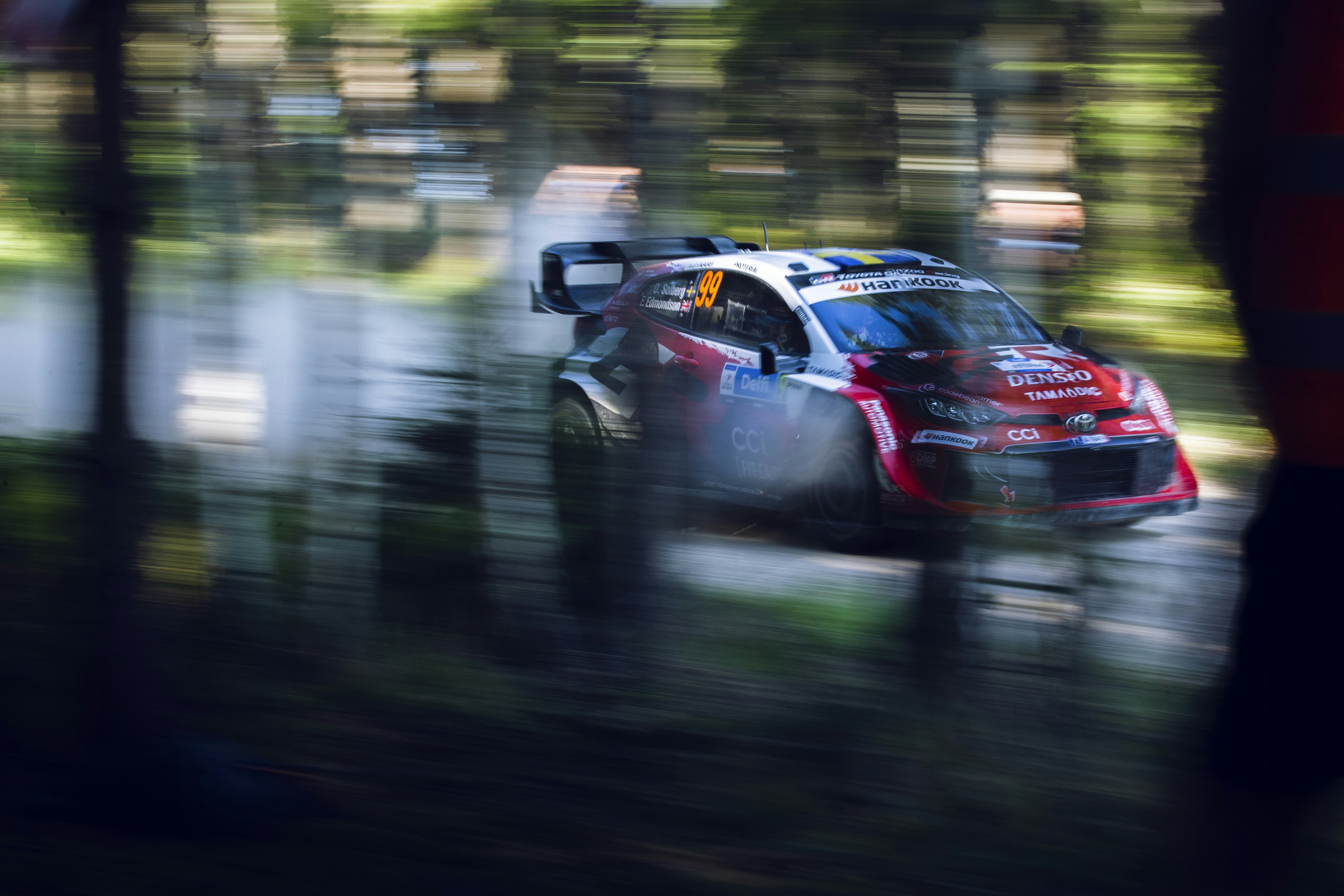 Blurring Power: A Rally Car in Narrow Escape