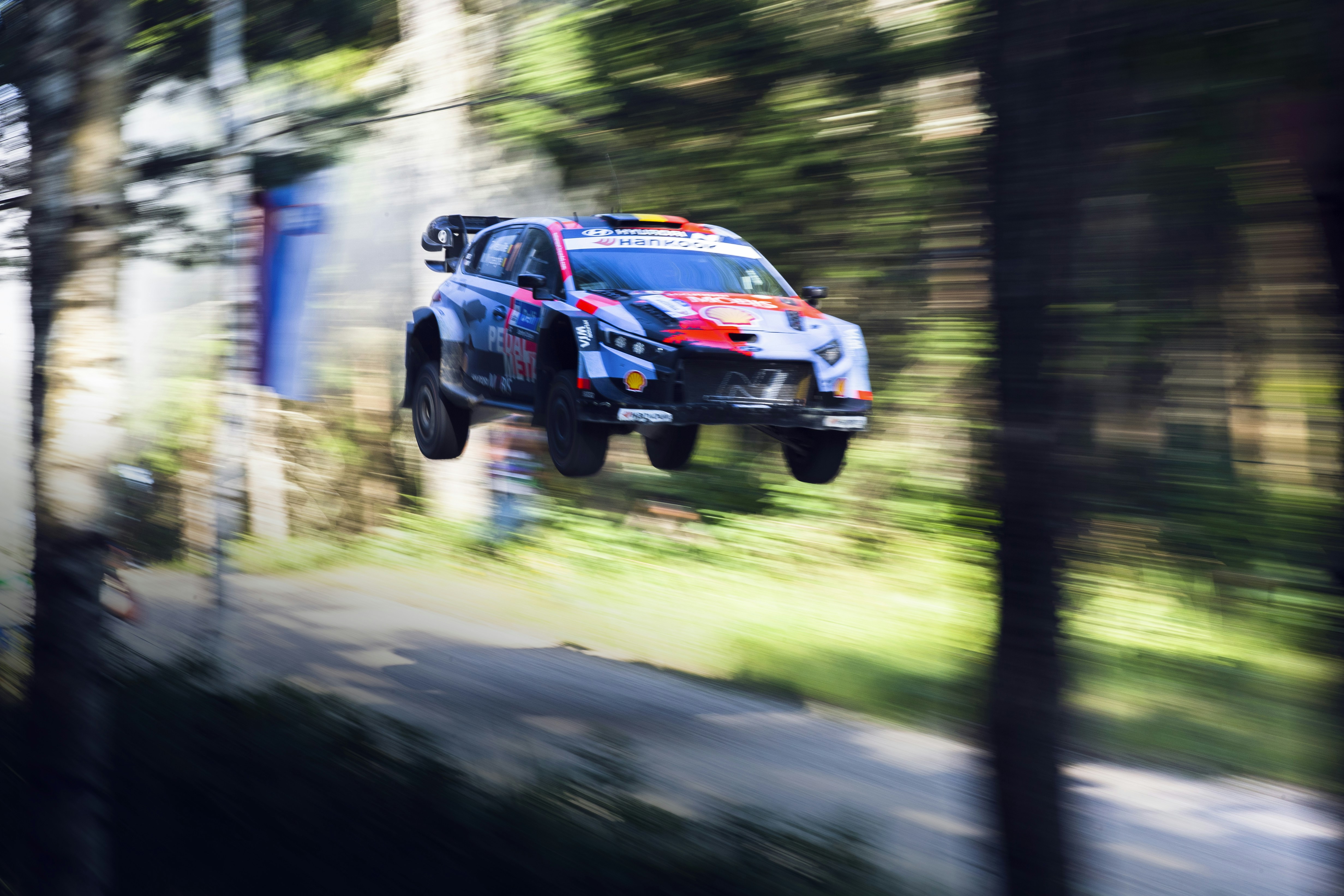 Rally Flyer: Aerial Leap Through a Forest Punch
