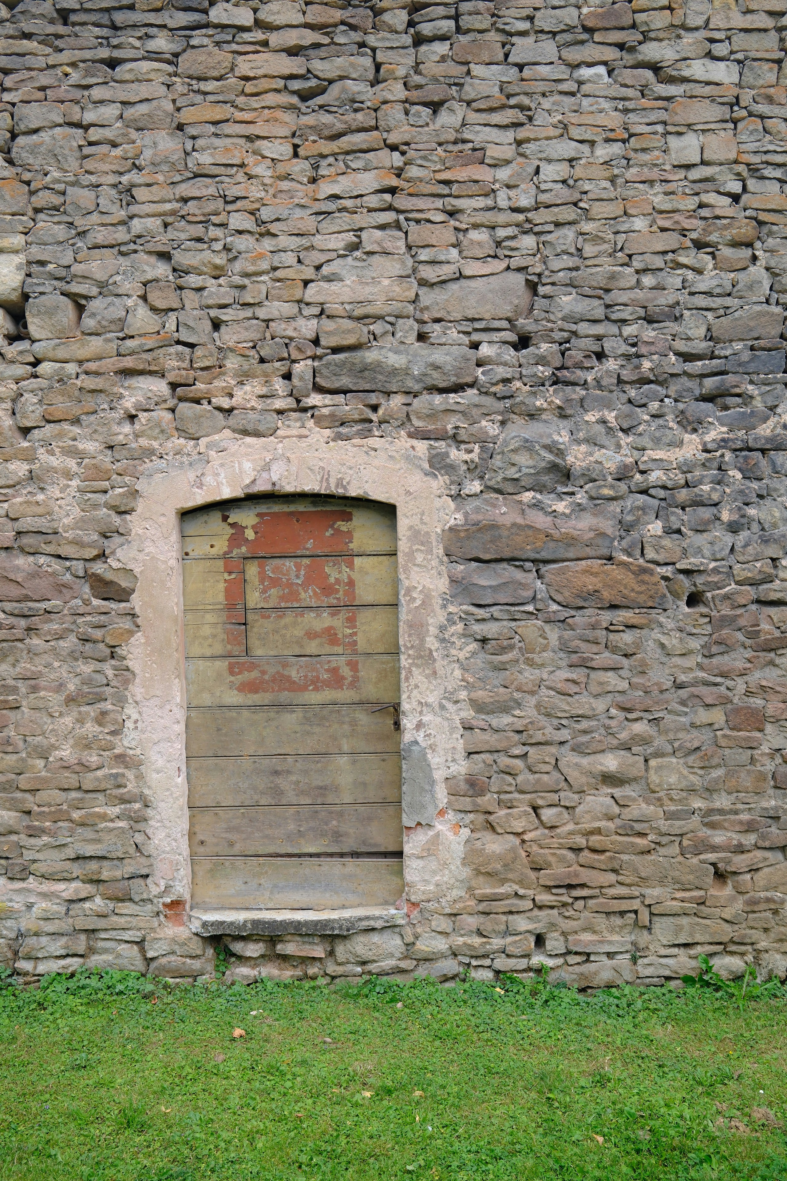 Weathered Doorway in a Stone Wall