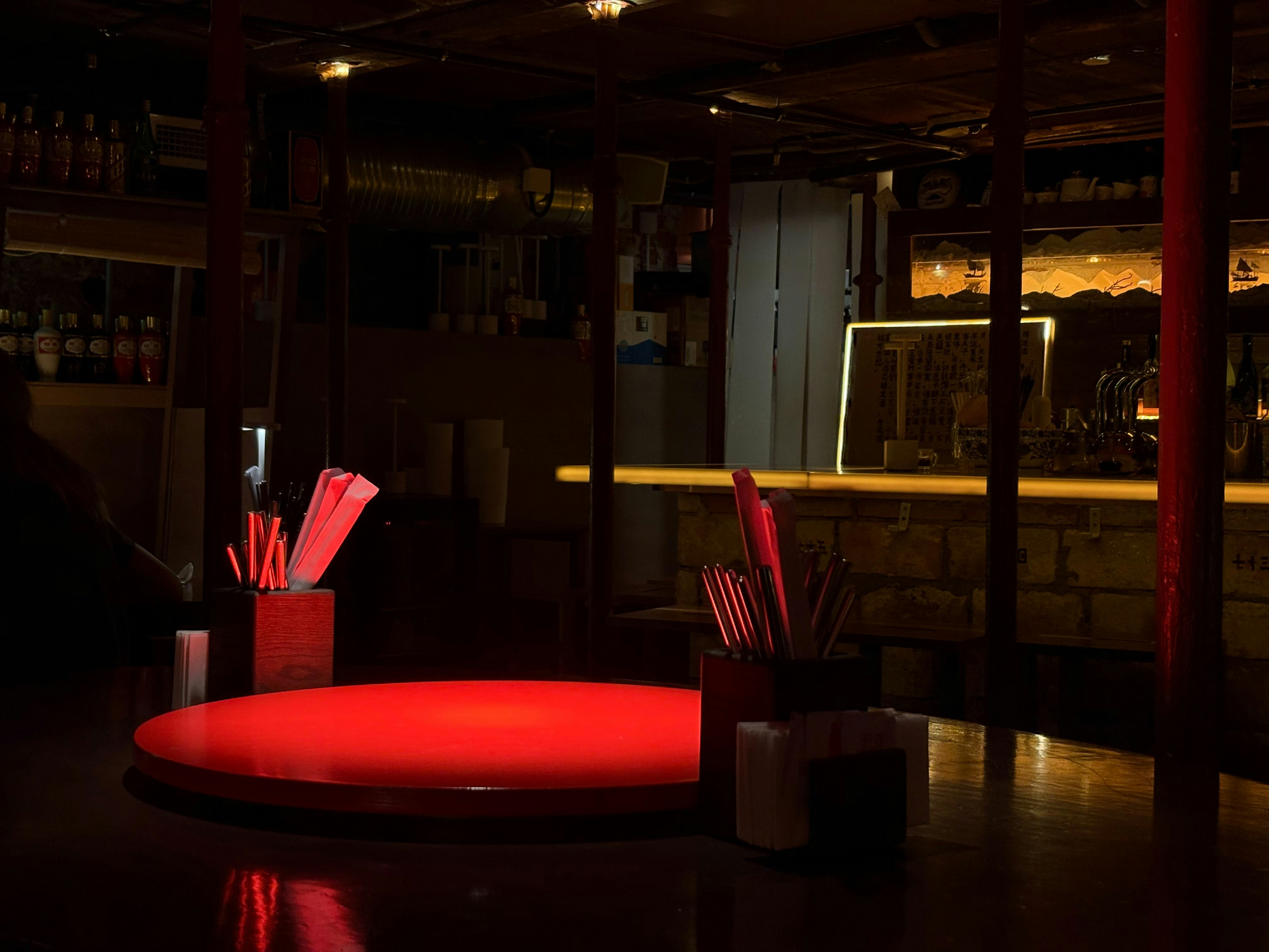 Red Circular Stage: Subdued Bar Spotlight
