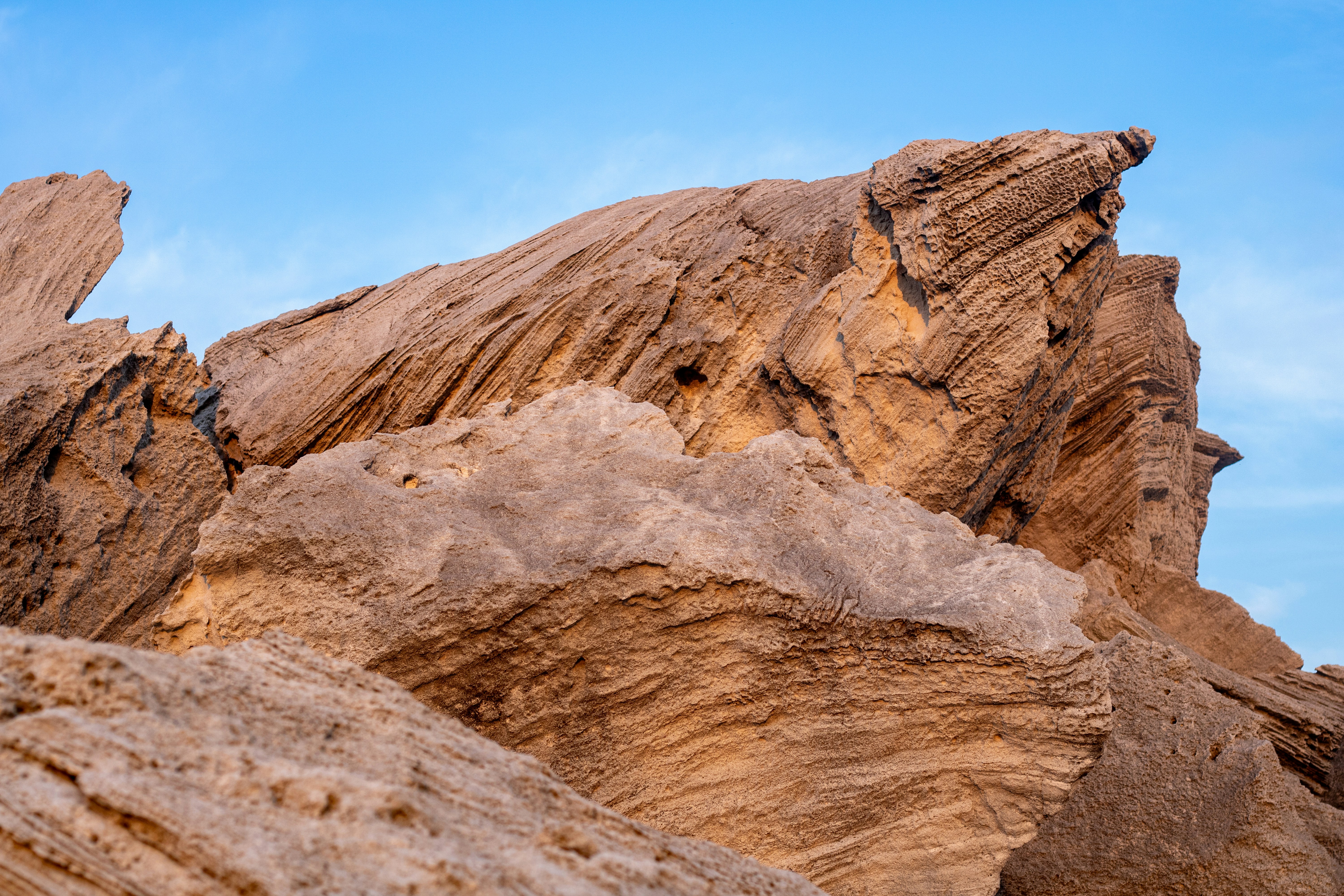 Desert Granite: Iron-washed Layers Beneath a Clear Blue Sky