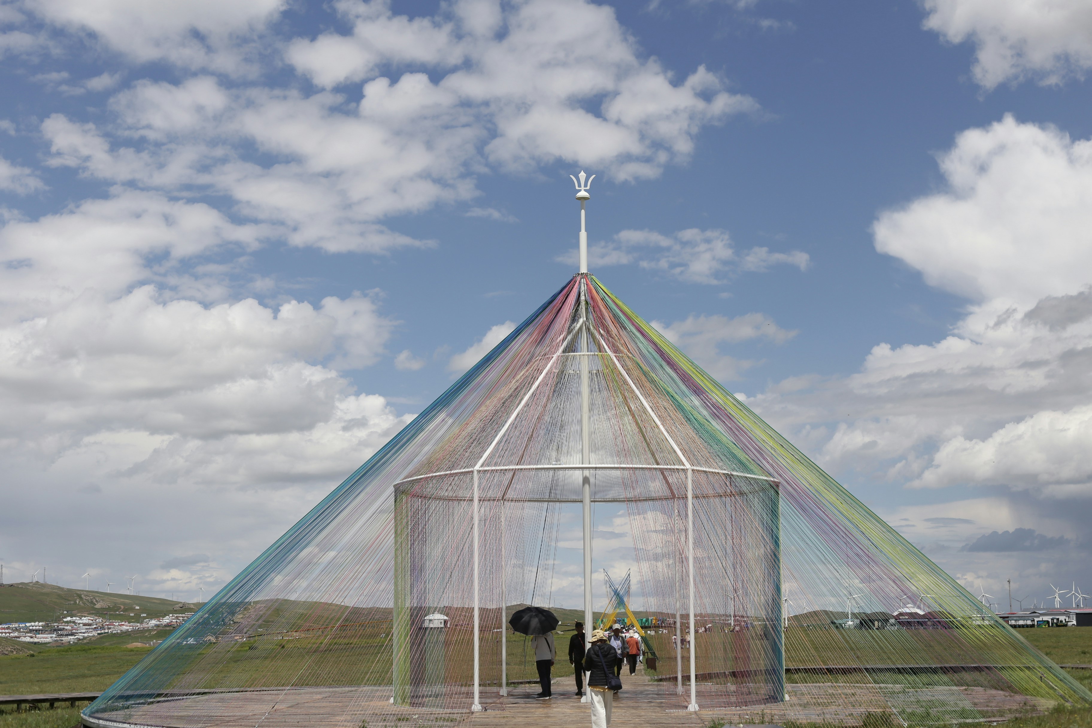Prismatic Lanterns: Visitors at the Rainbow-Tipped Pavilion