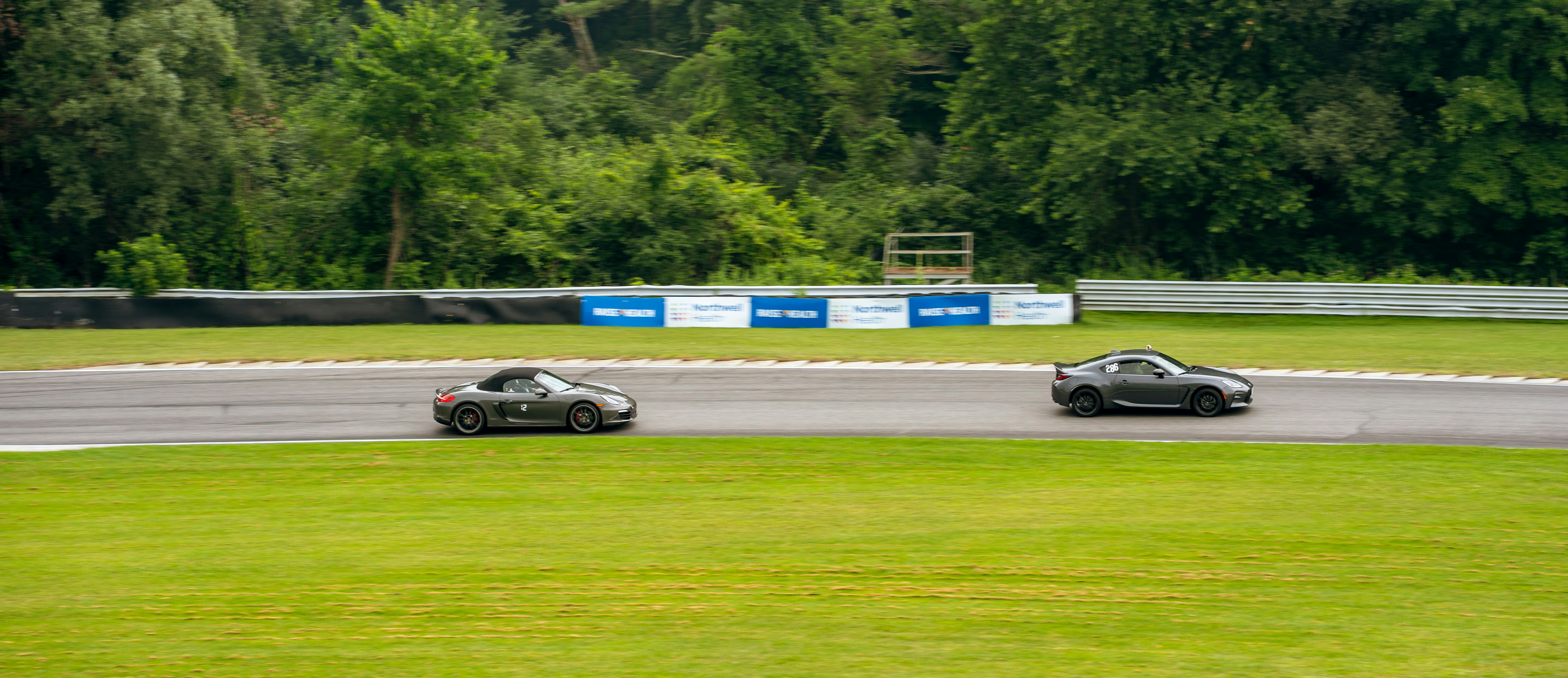 Dual-Ghost on the Track: A Tale of Two Coupes