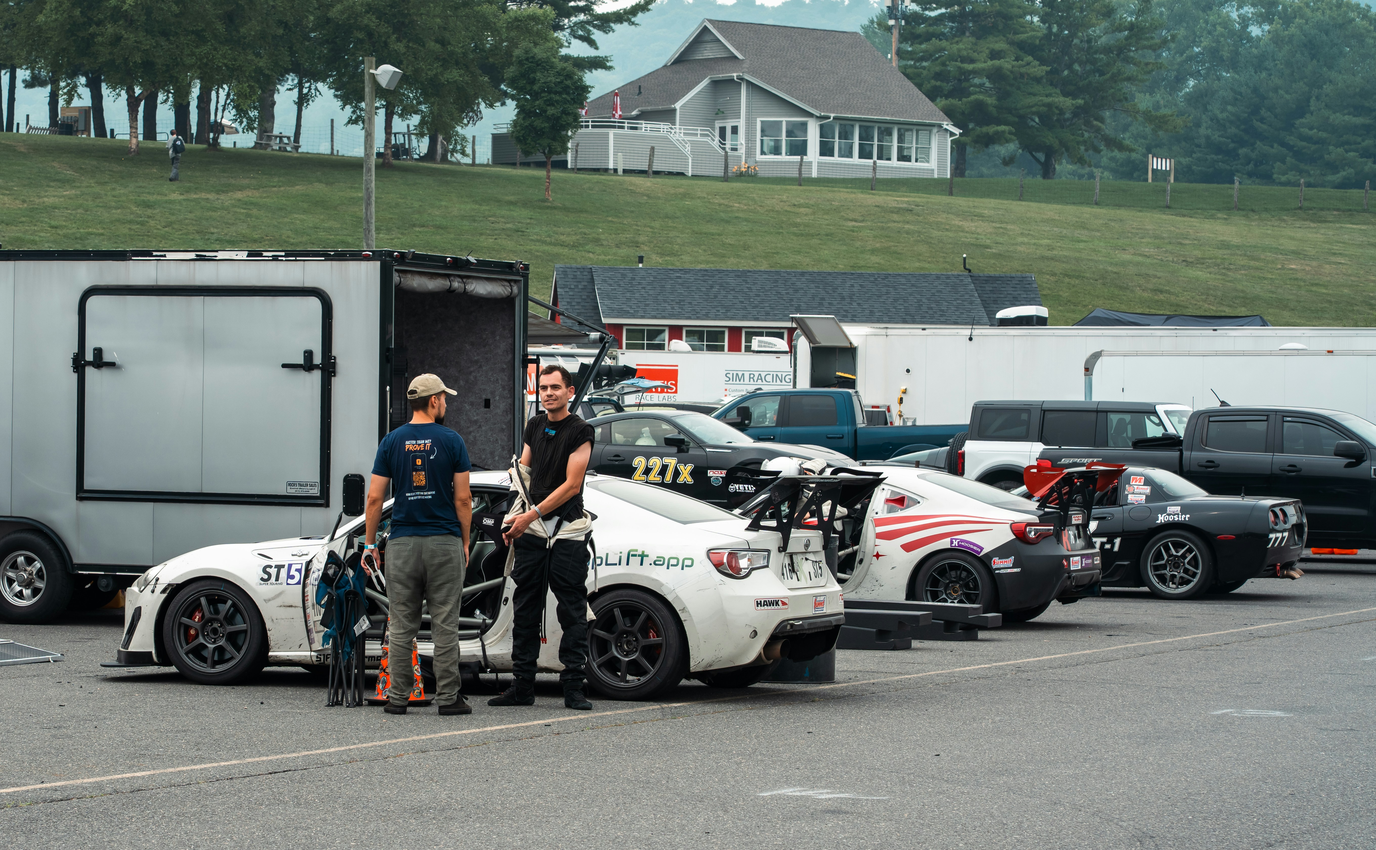 Pit Lane Dialogue: Mechanics and Race Cars in the Parked Line