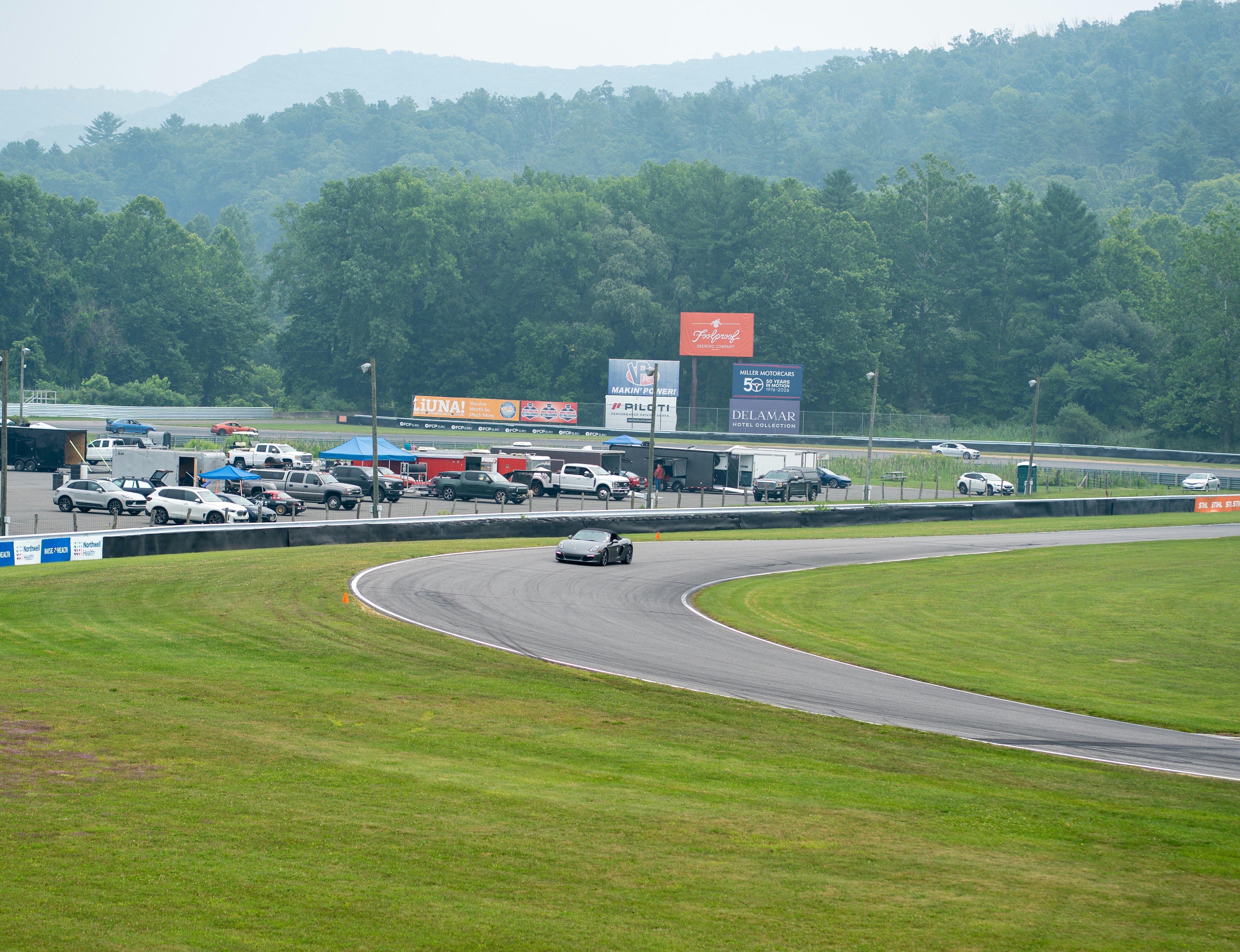 Car Cresting the Curve: A Quiet Moment at the Raceway