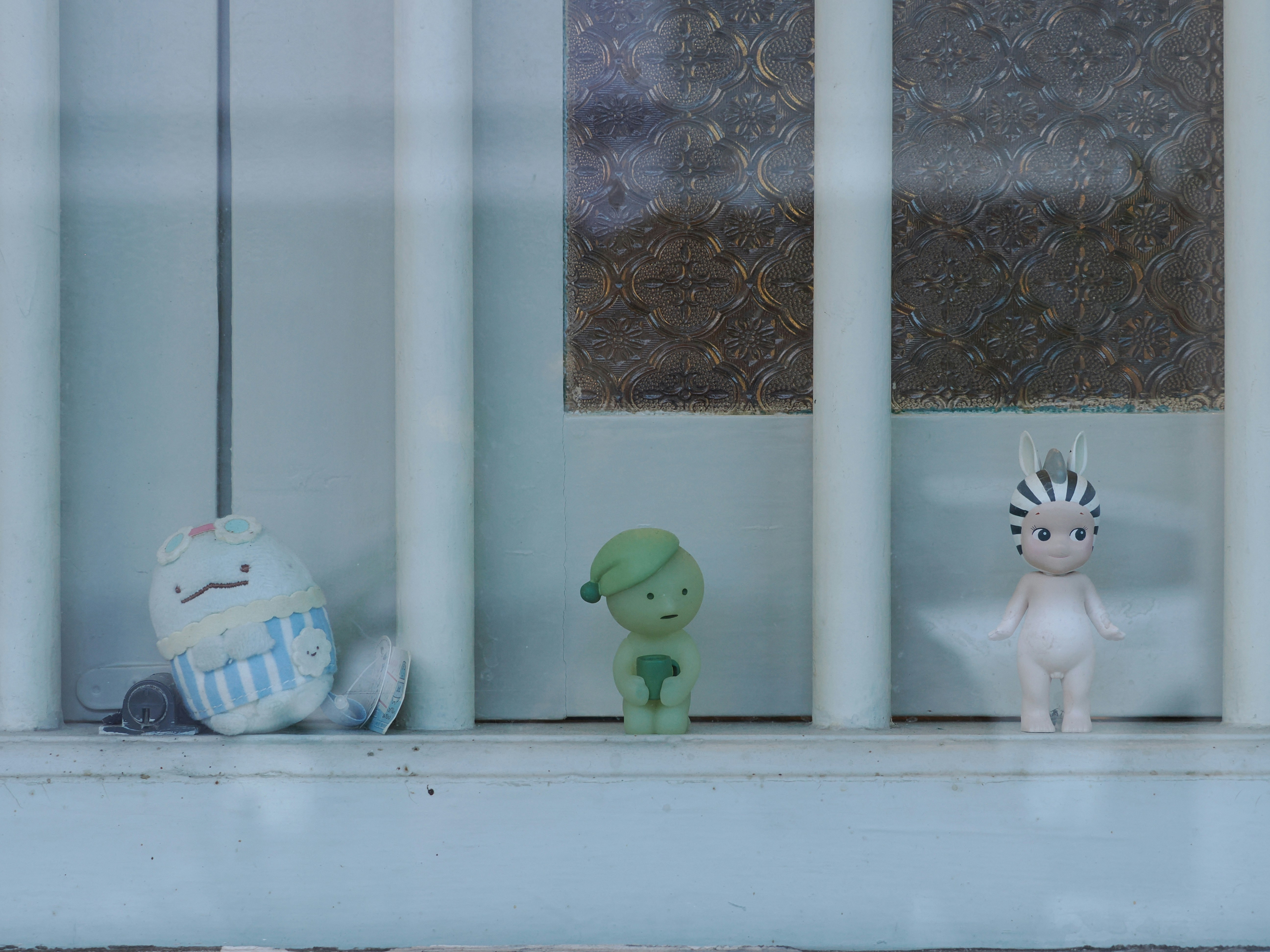 Small Figures on a Windowsill: Quiet Playground of Toys