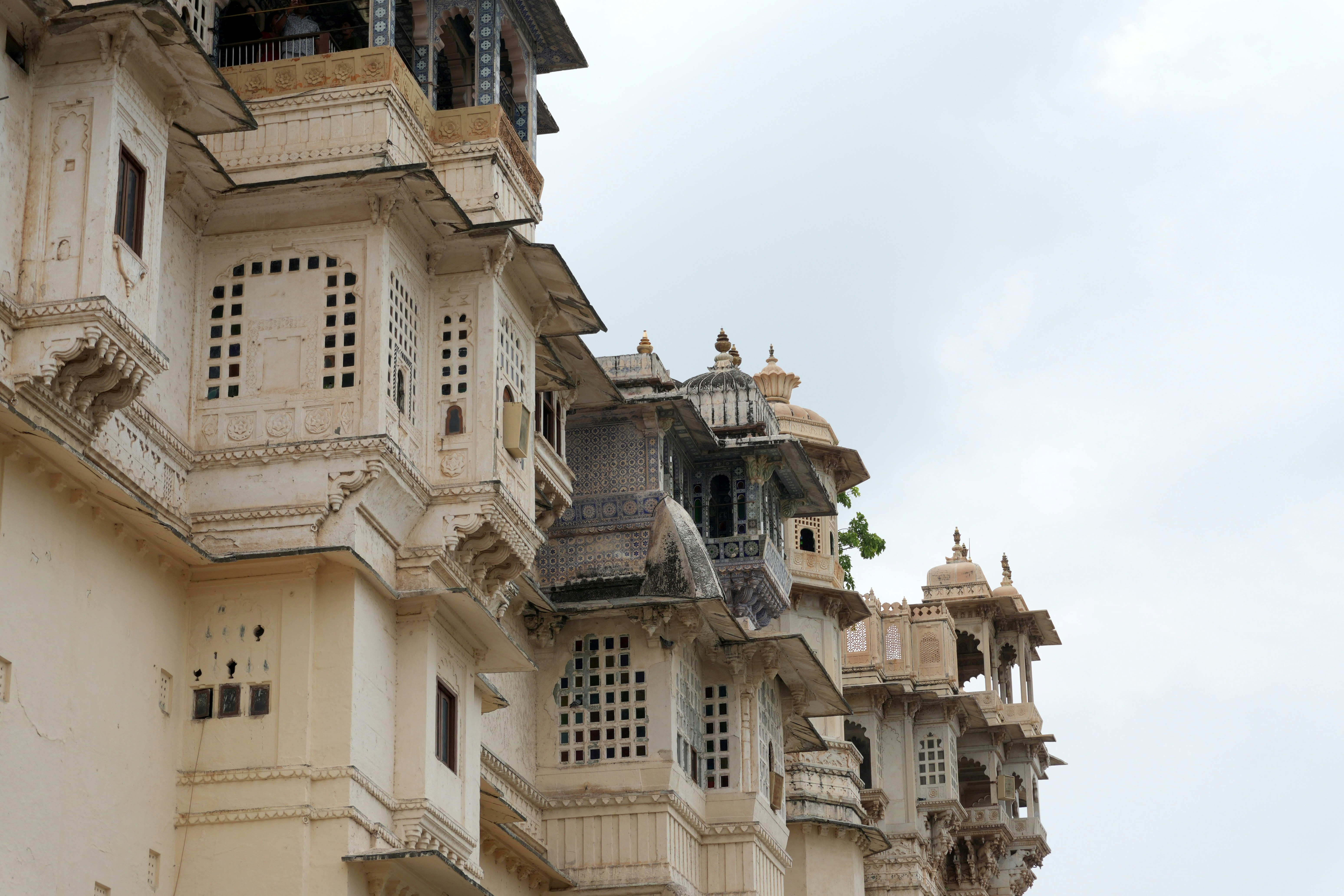 Ornate Jharokha Towers Rise Against a Pale Sky