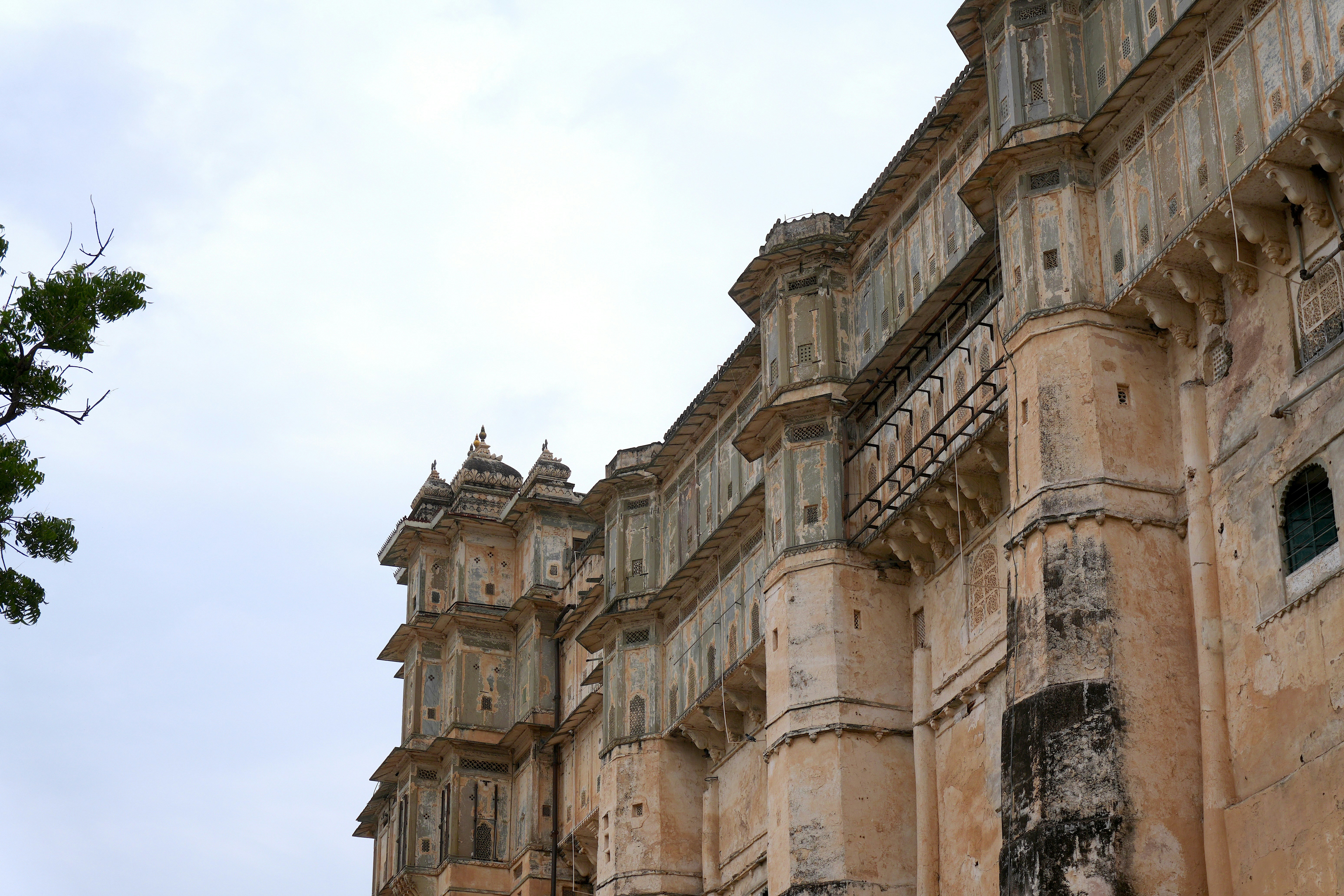 Ancient Facade Rising: Weathered Fortunes of Stone and Sky