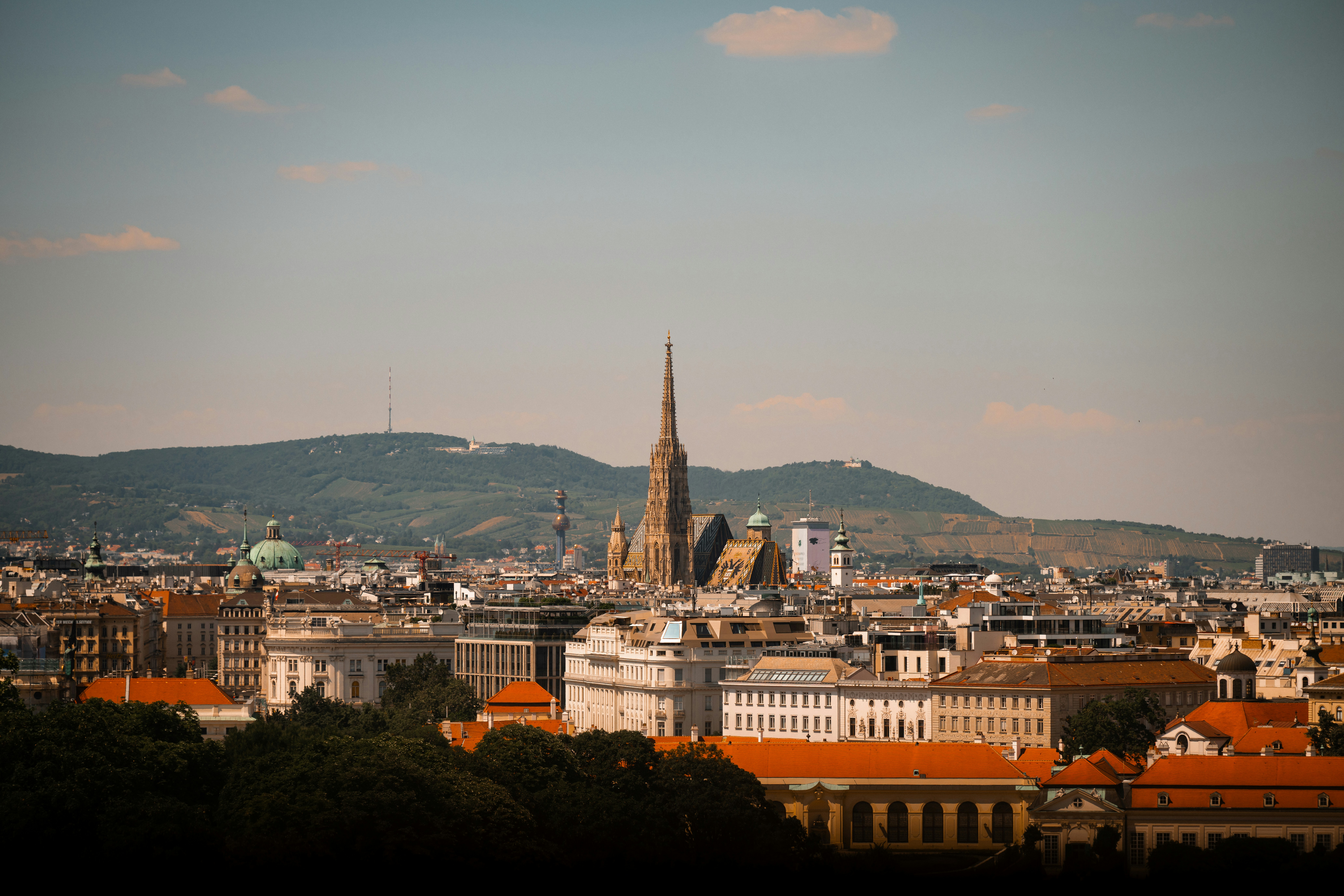 City Crown: A Prague-like Skyline with a Prominent Spire Rising Above Red Rooftops