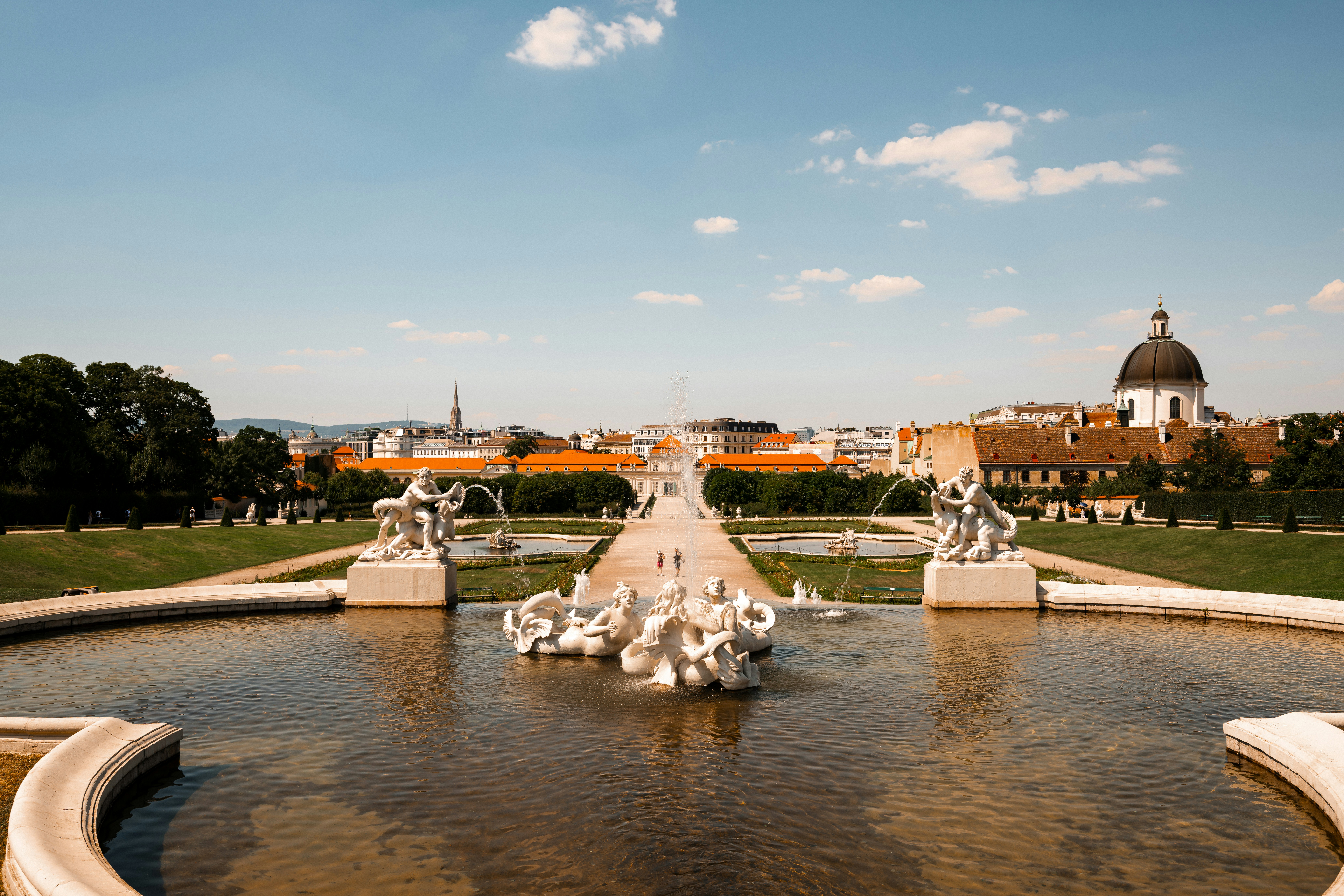 Statues at the Fountain: symmetry and sky over the grand plaza