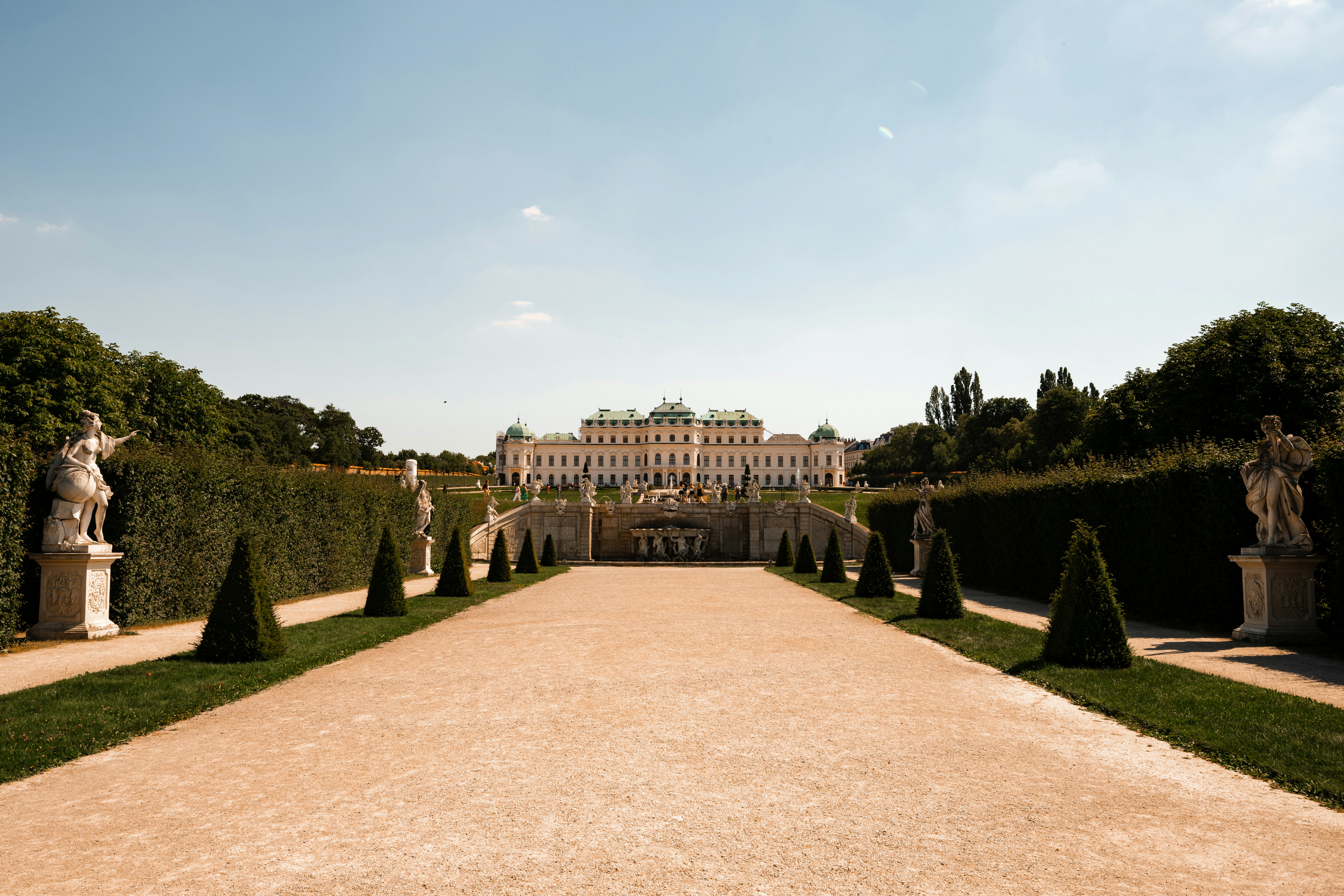 Symmetrical Palace Approach: A Sunlit Axial Path to Grand Grounds