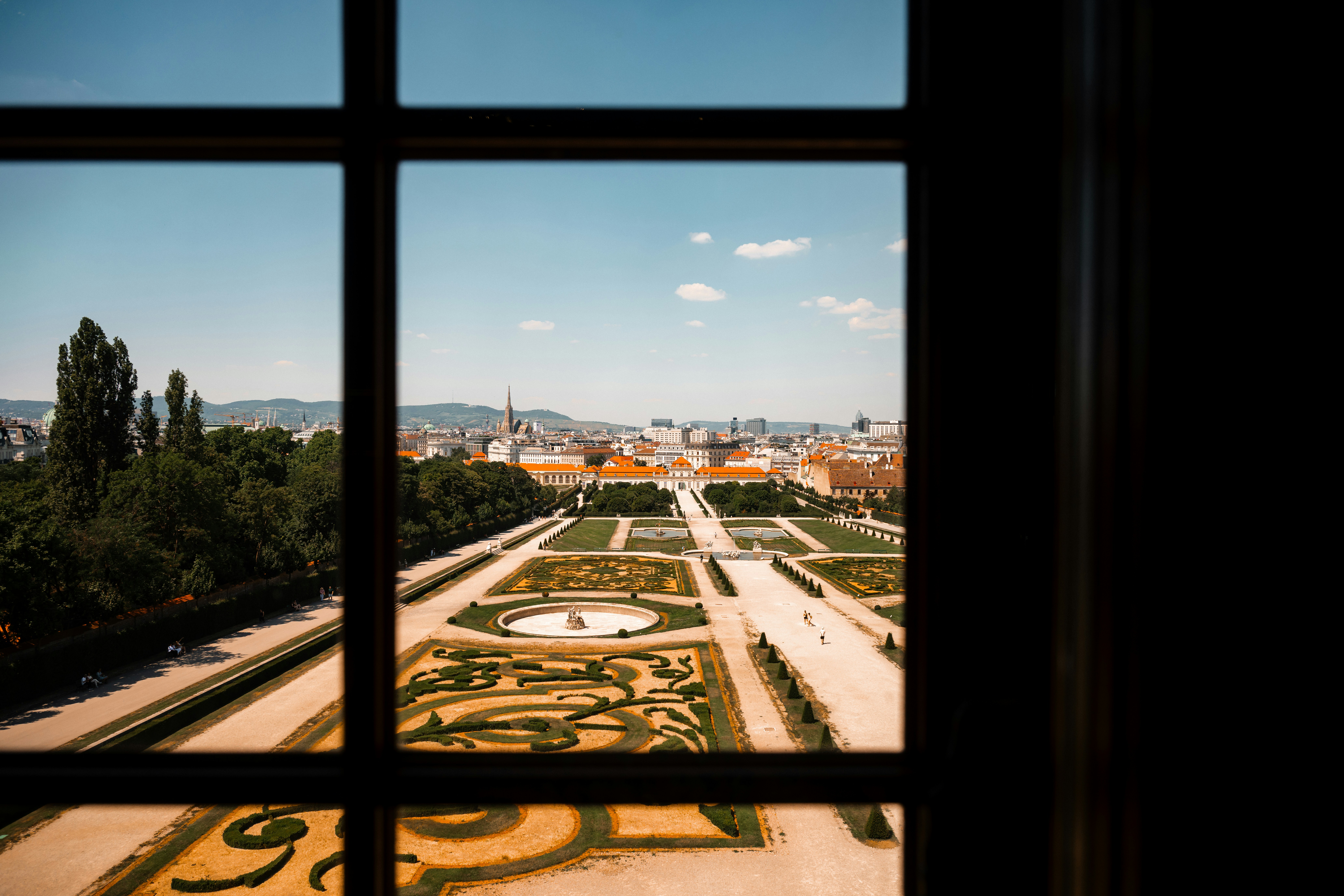 A Carved Vista: Formal Gardens Framing a City Skyline