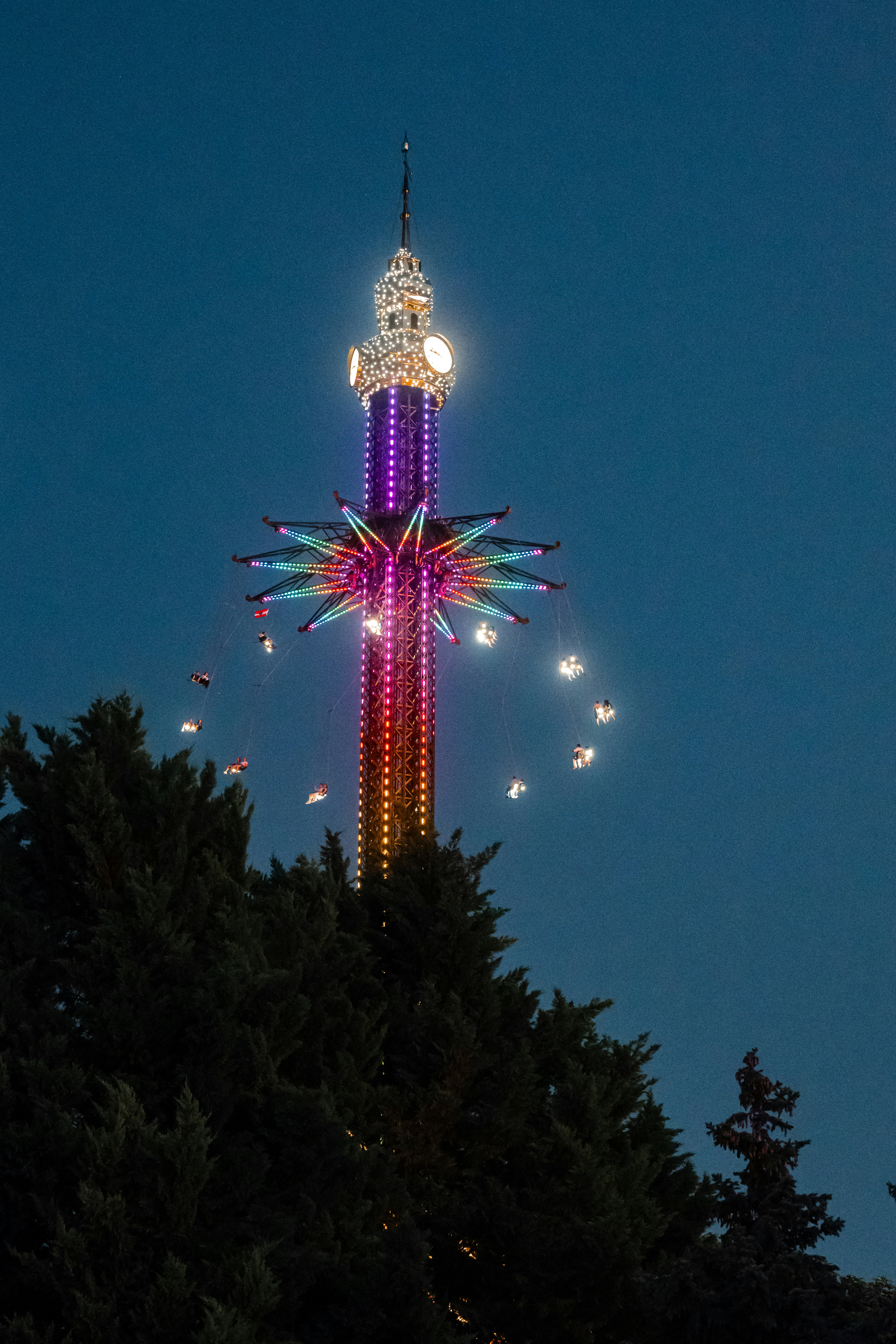 Neon Spire: A Night Ride Above the Trees
