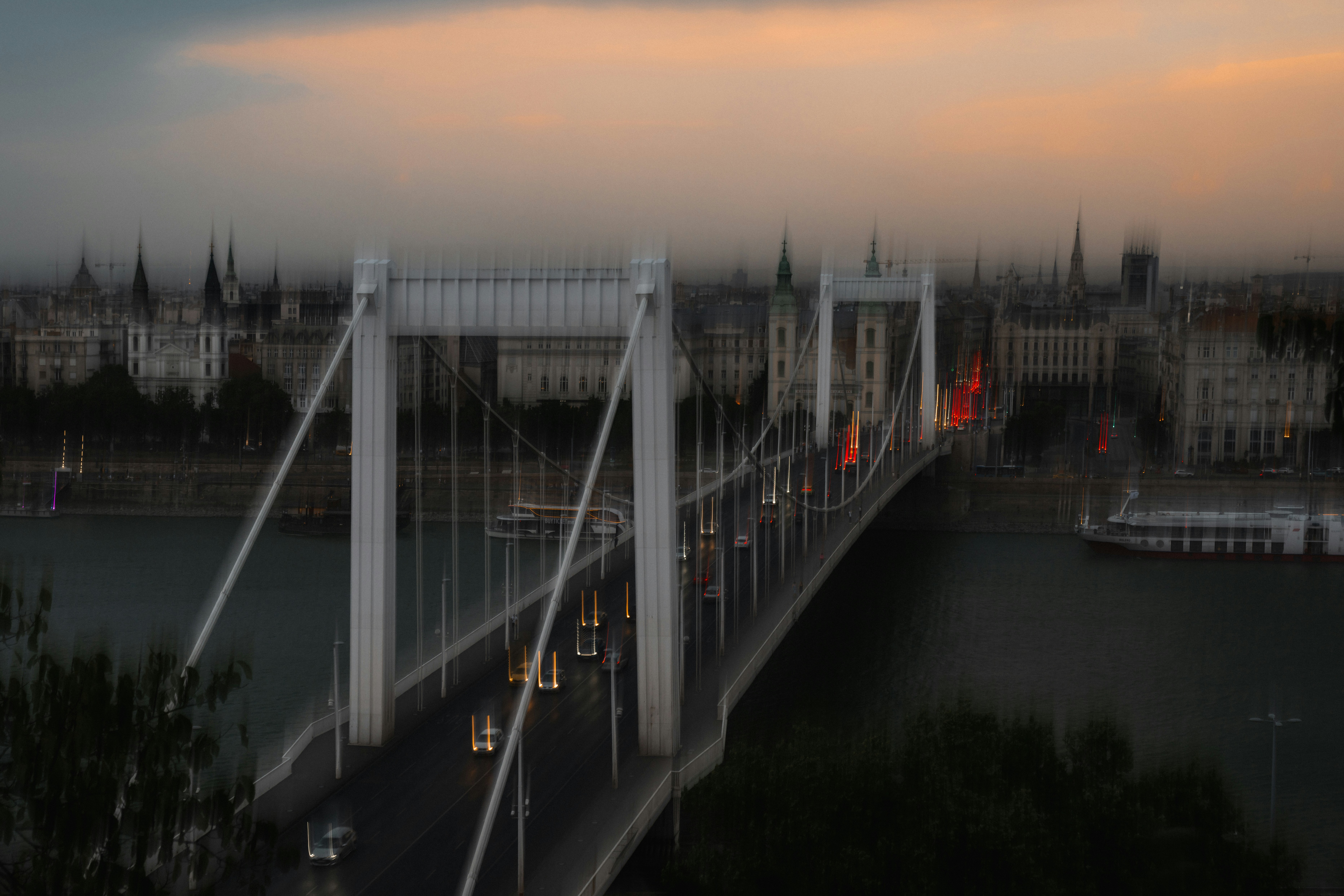 Bridge Under Twilight: City Lights Loom Over the Thames