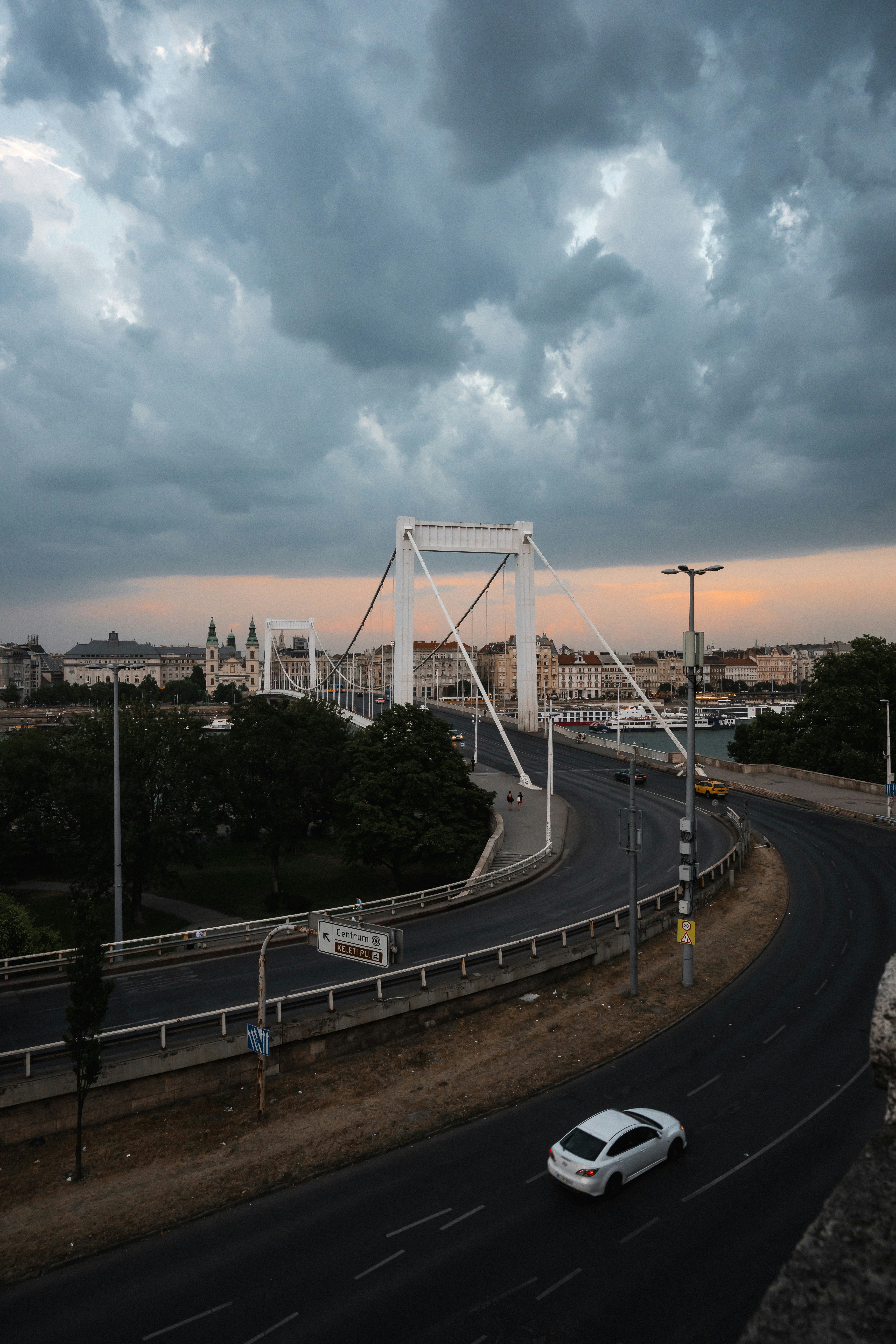 Bridge Over City Lights: A Sunset Postal of Steel and Streets
