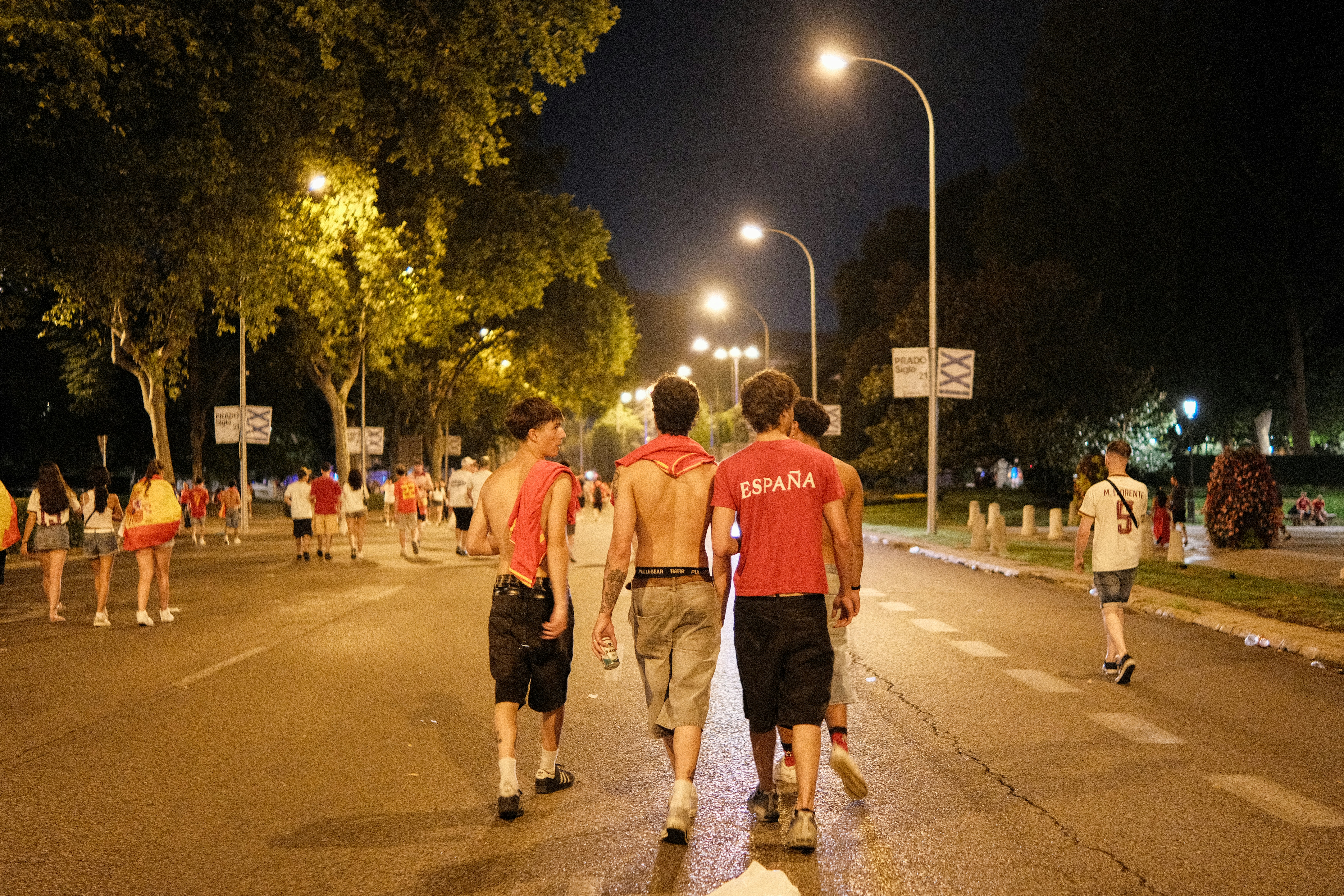 Night Walk of the Team in a Quiet Avenue