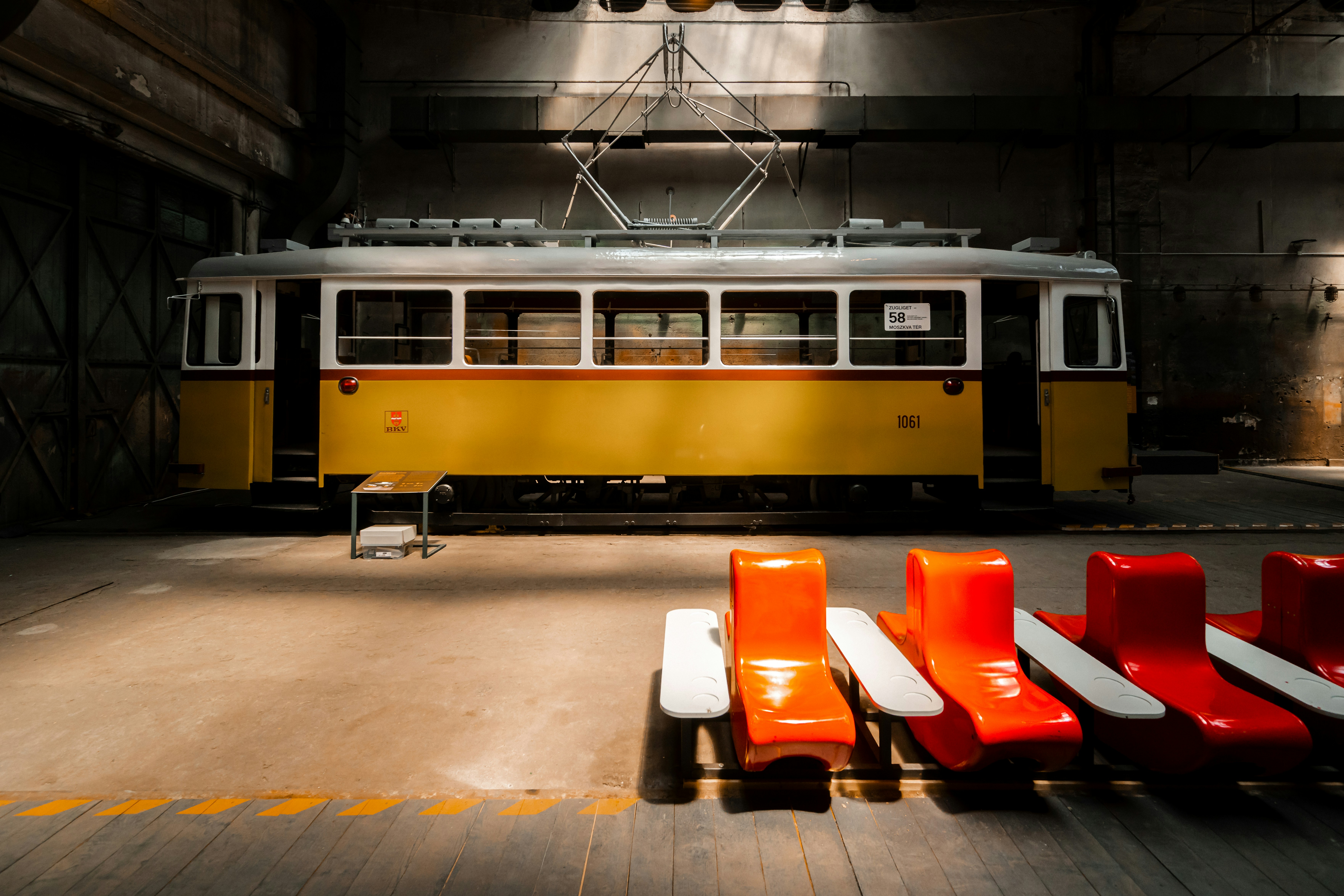 Abandoned Tram in a Dim Industrial Hall