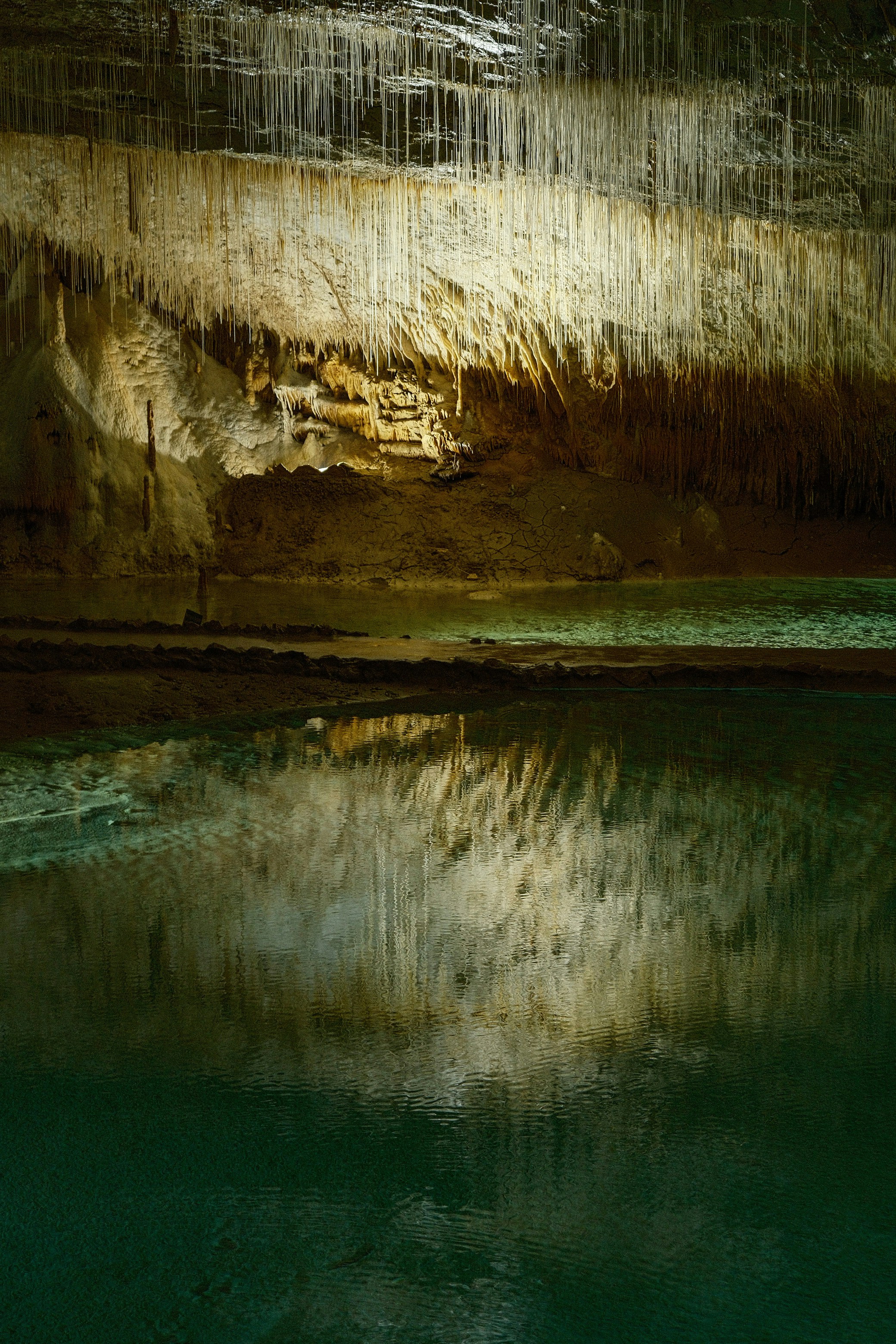 Undercave Mirror: stalactites and turquoise pool