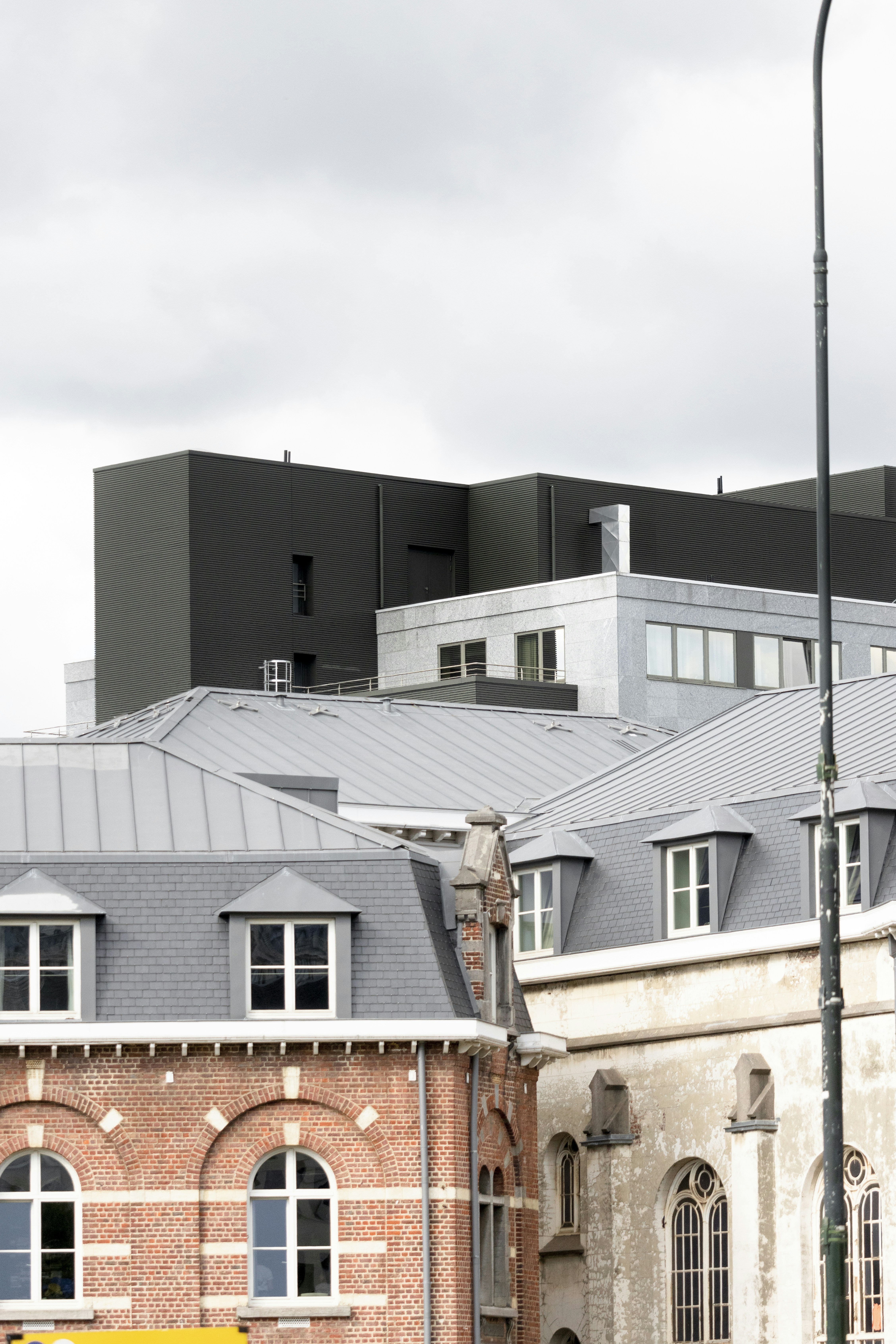 Urban Rooftops: Brick Facades Meet Modern Silhouettes