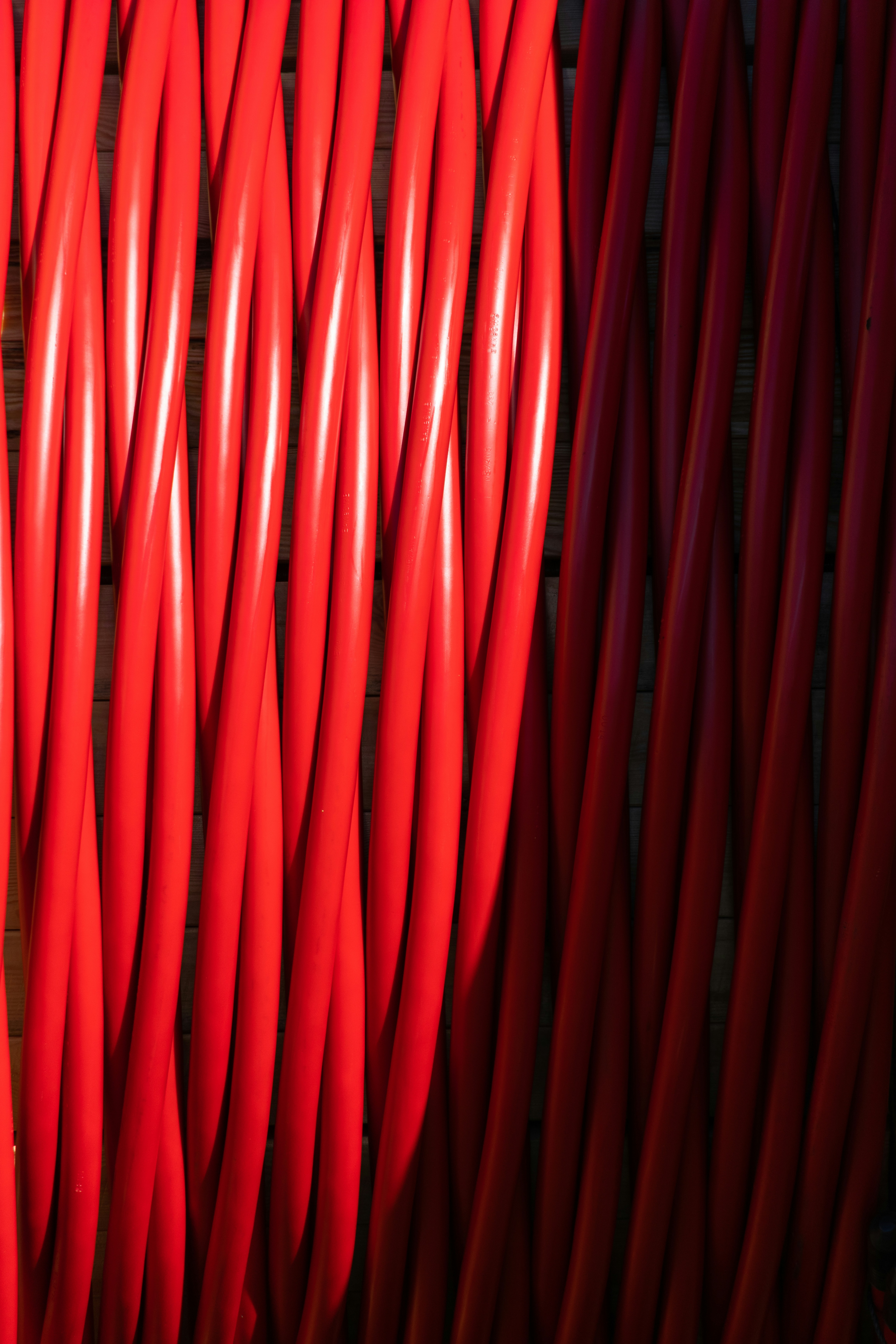 Coiled Crimson—A Tangle of Red Cylinders in Light and Shadow