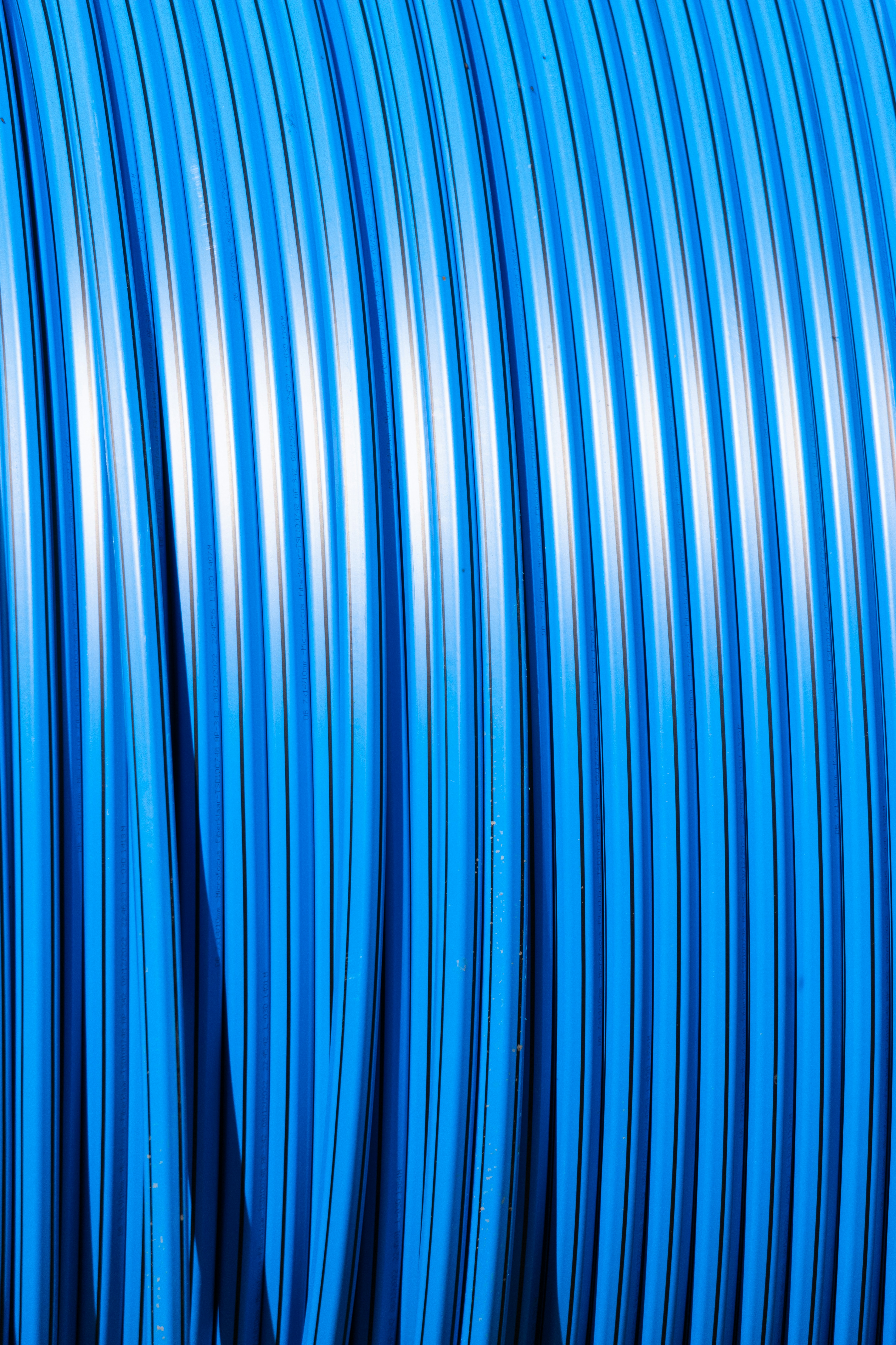 Blue Corrugated Rhythm: Vertical Stripes in a Neon Tide