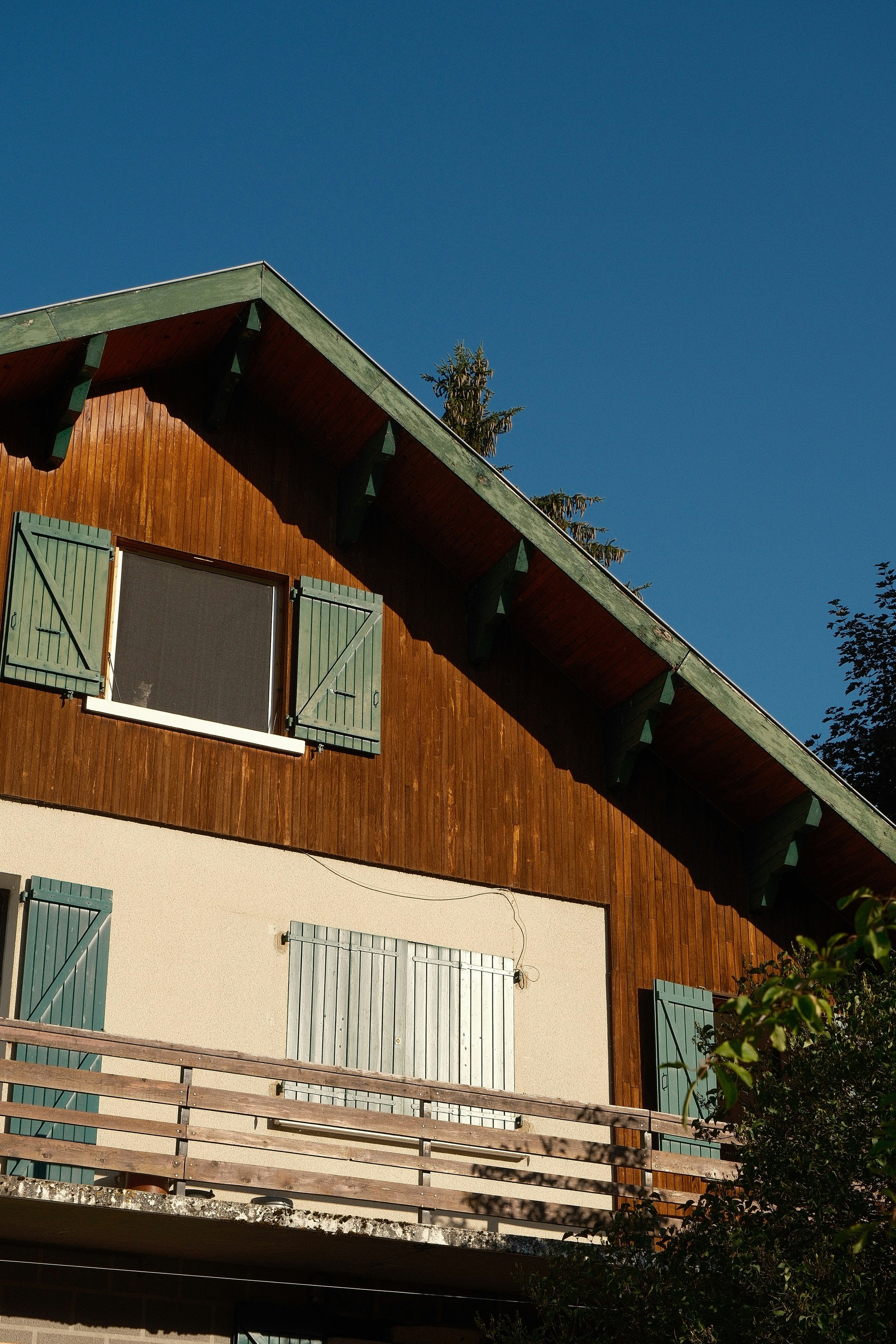 Sunny Chalet Gable Under a Clear Blue Sky