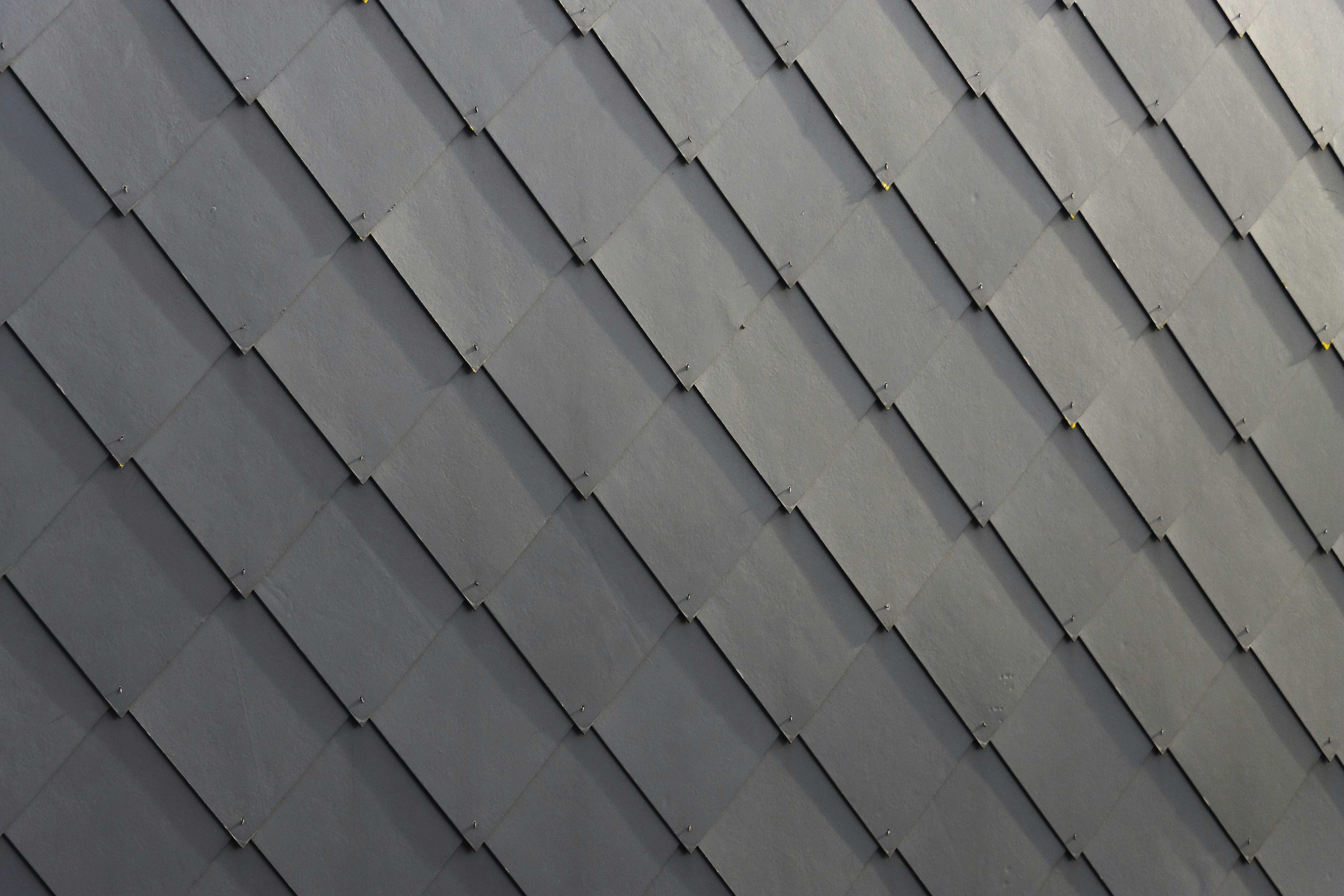 Dark gray rectangular tiles arranged in a diagonal pattern.