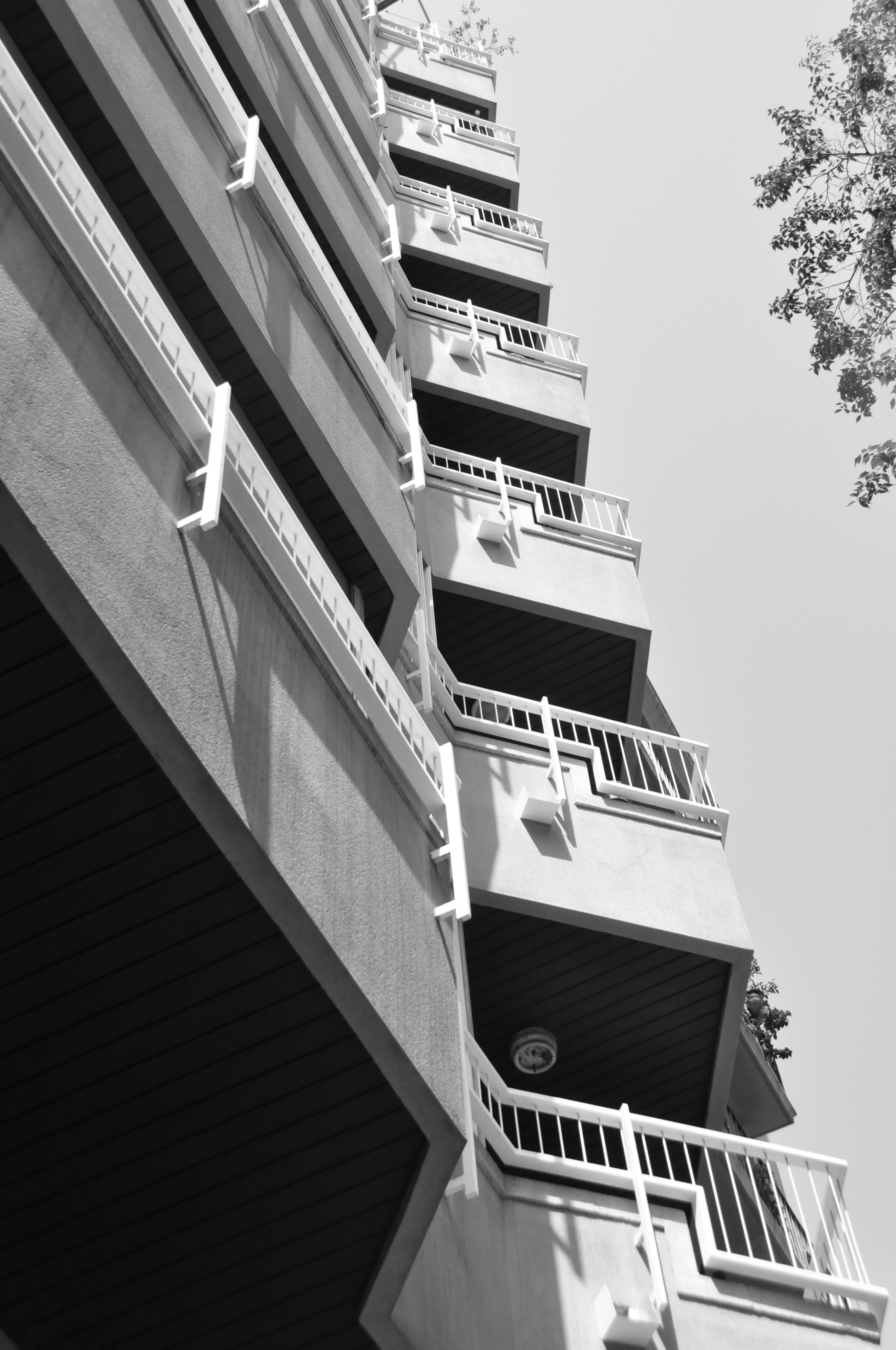 Ascending Geometry: A Vertical Play of Balconies and Shadows