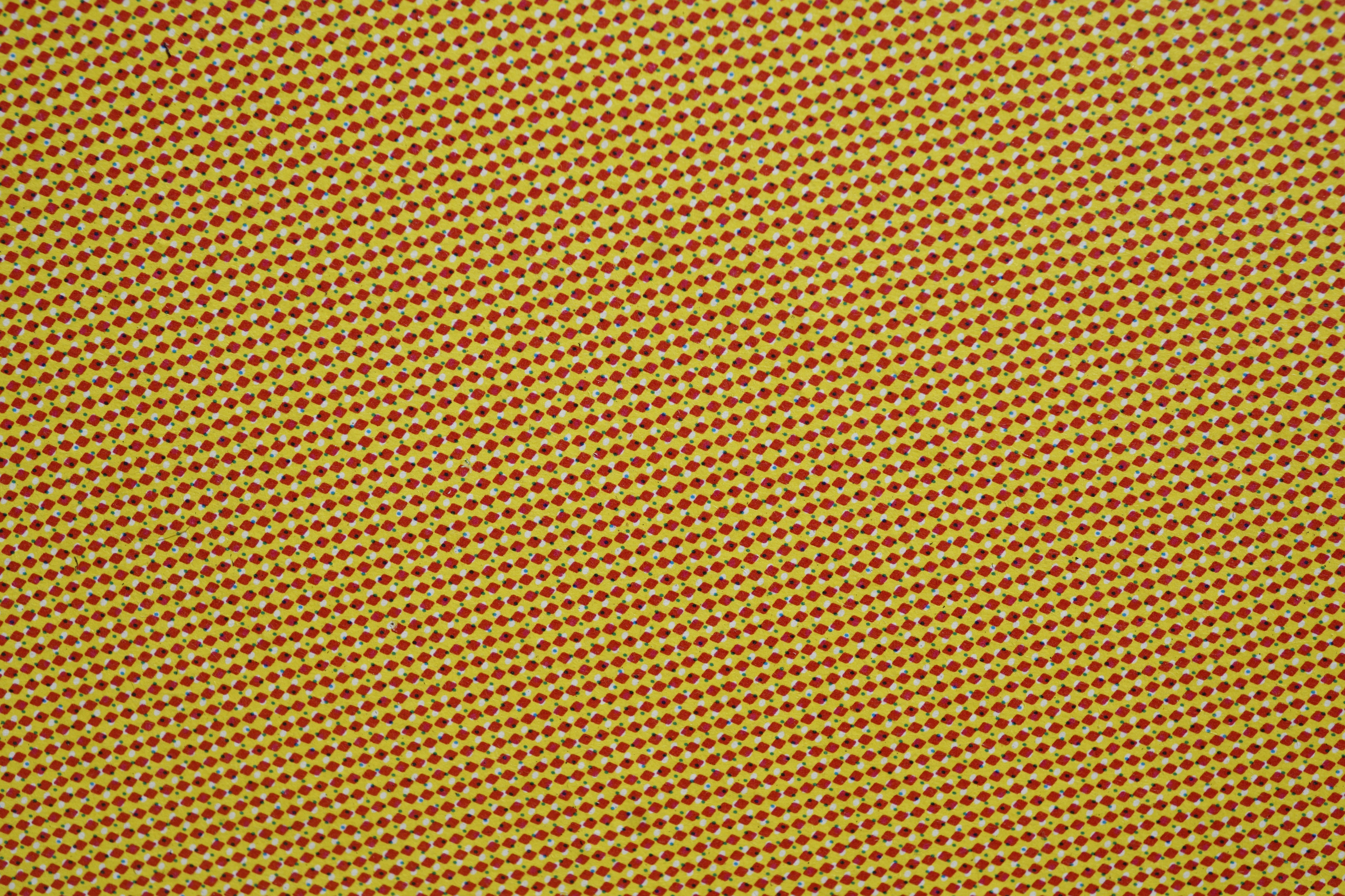 Chevron Threads: A Macro Portrait of a Golden-Dotted Weave