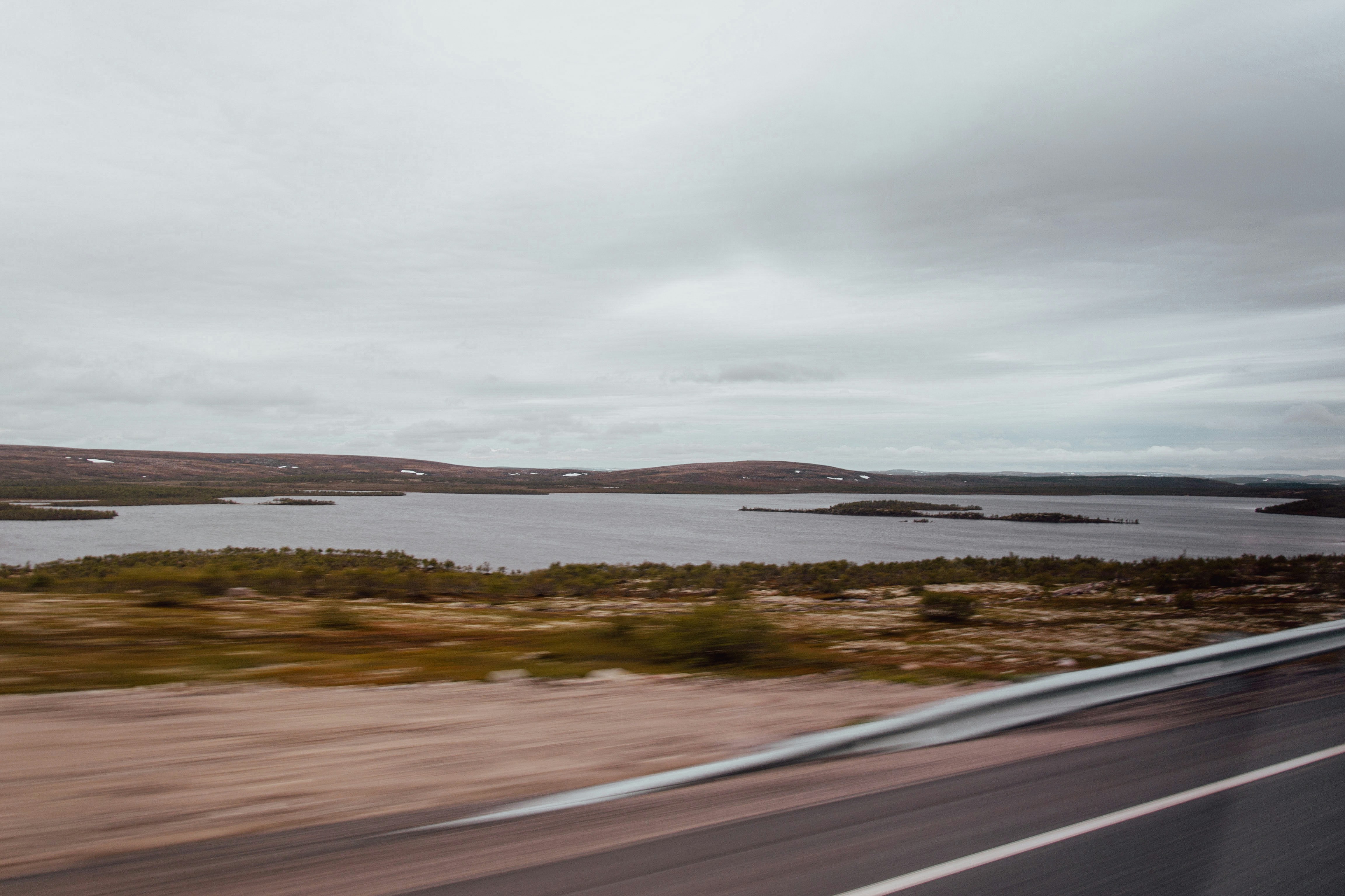 Blurry Highway Over Lake Fjord