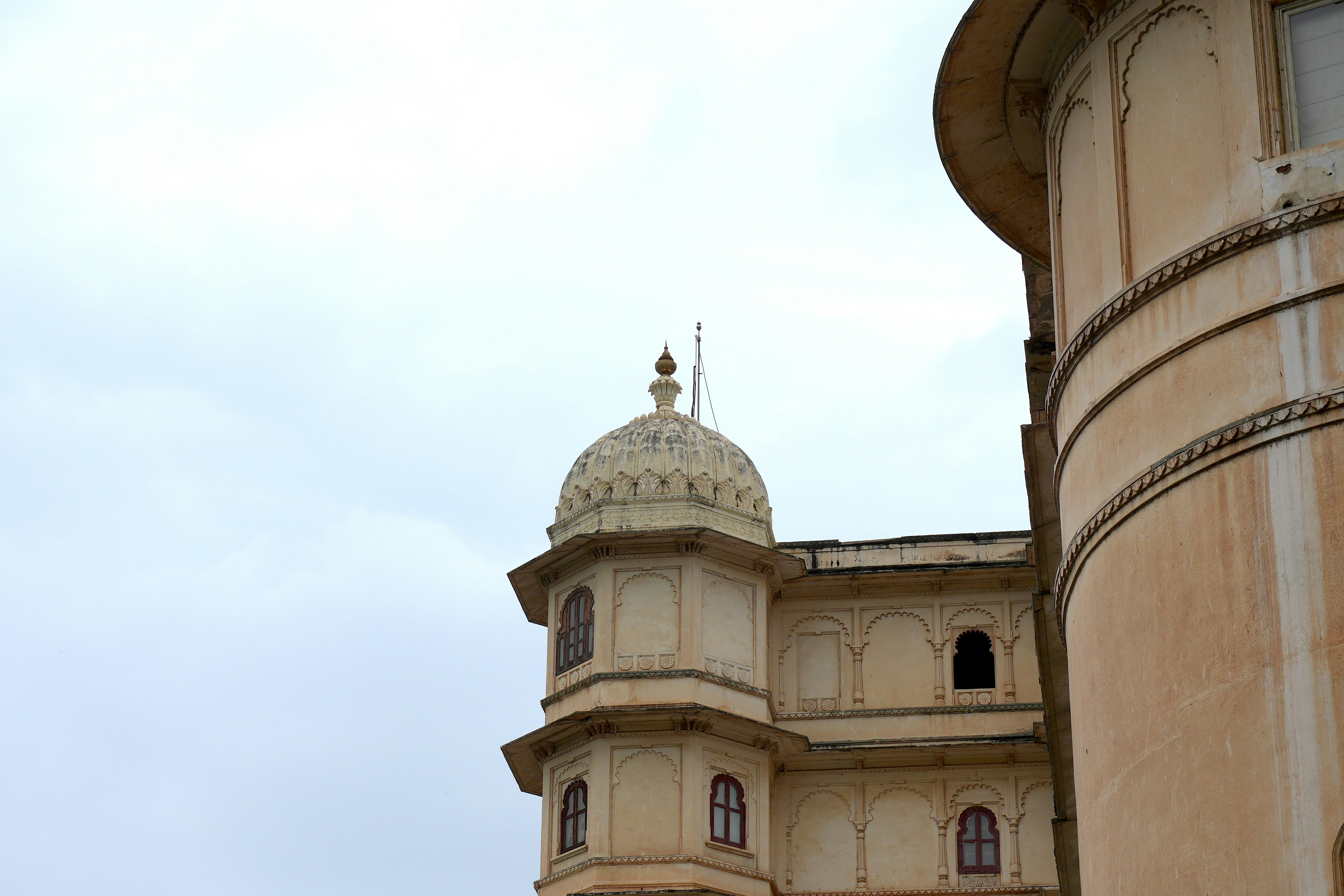 Turreted Corner: Sunlit Facade of an Ornate Building