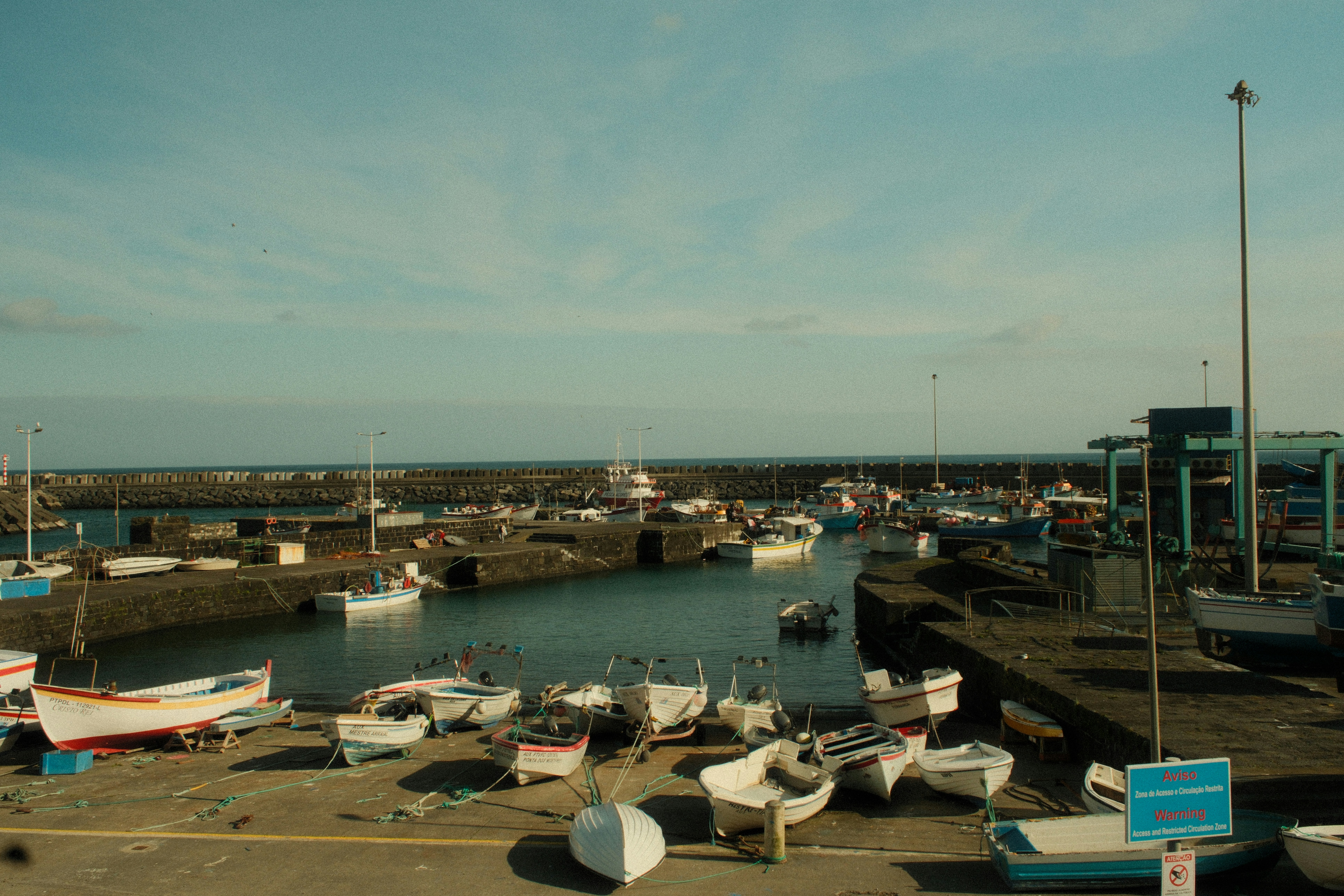 Harbor Echo: Boats Resting in a Quiet Seaside Port