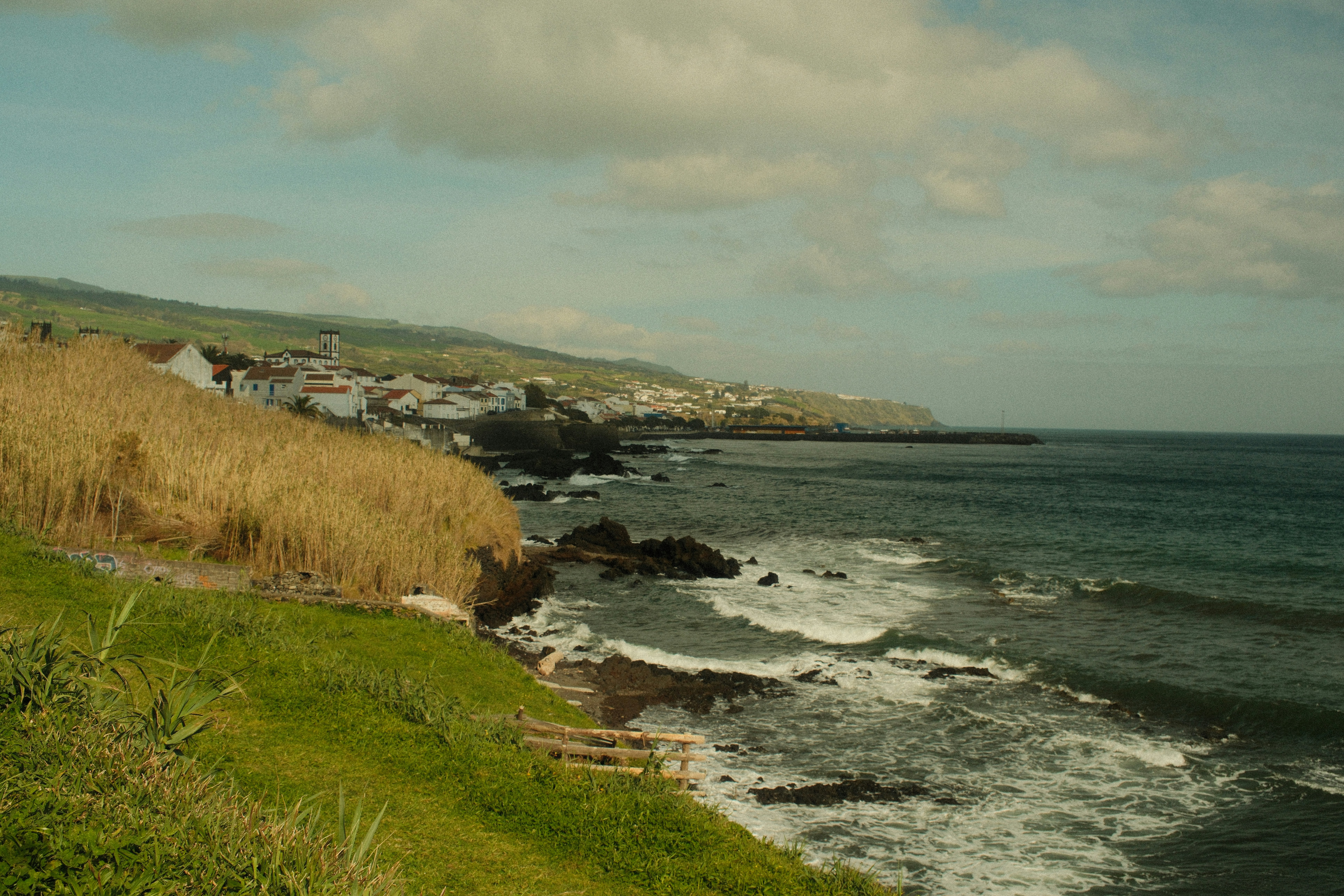 Coastal Cliffs and Village at Dusk