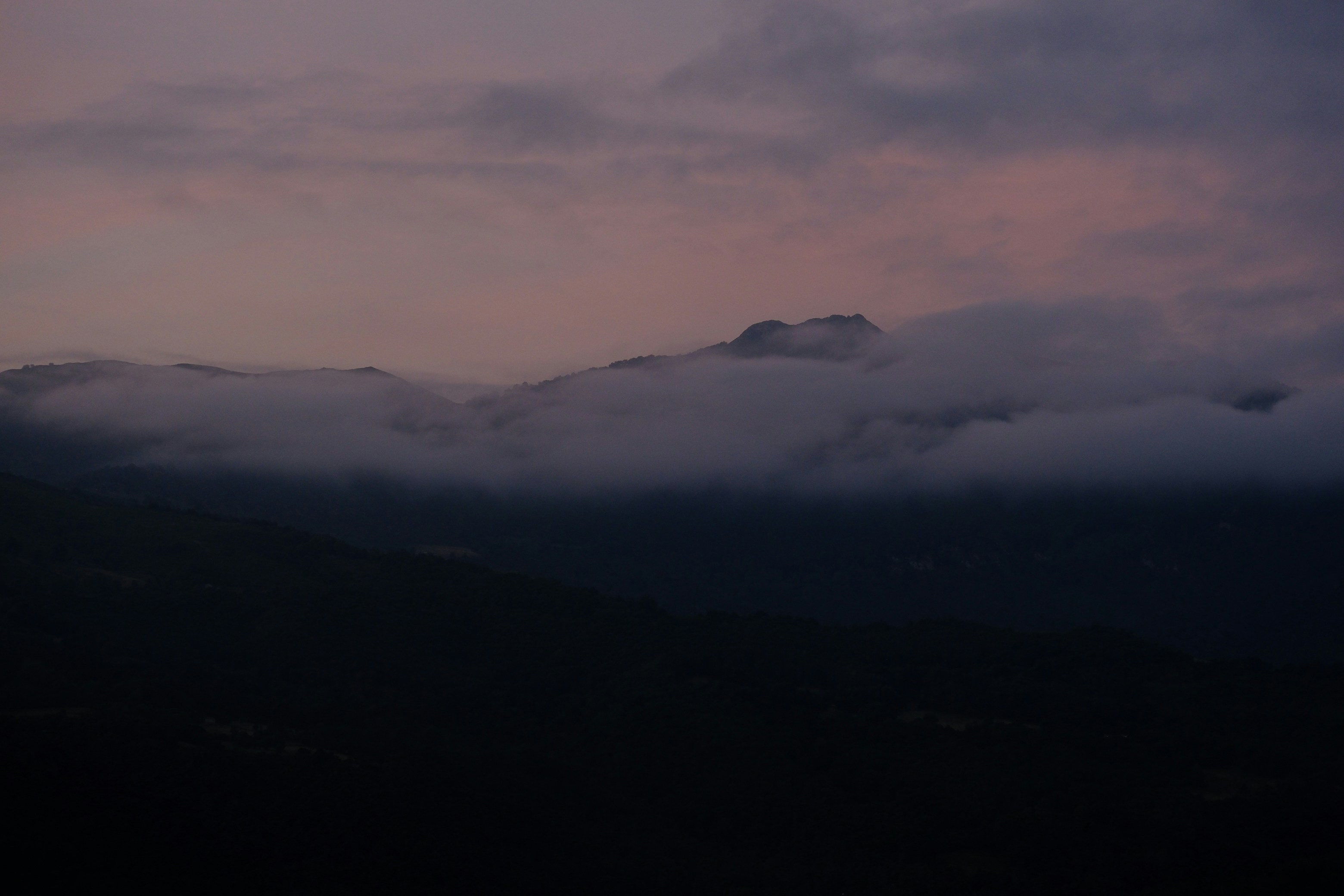 Above the Quiet Ridge: Layers of Dawn Mist over a Silent Valley