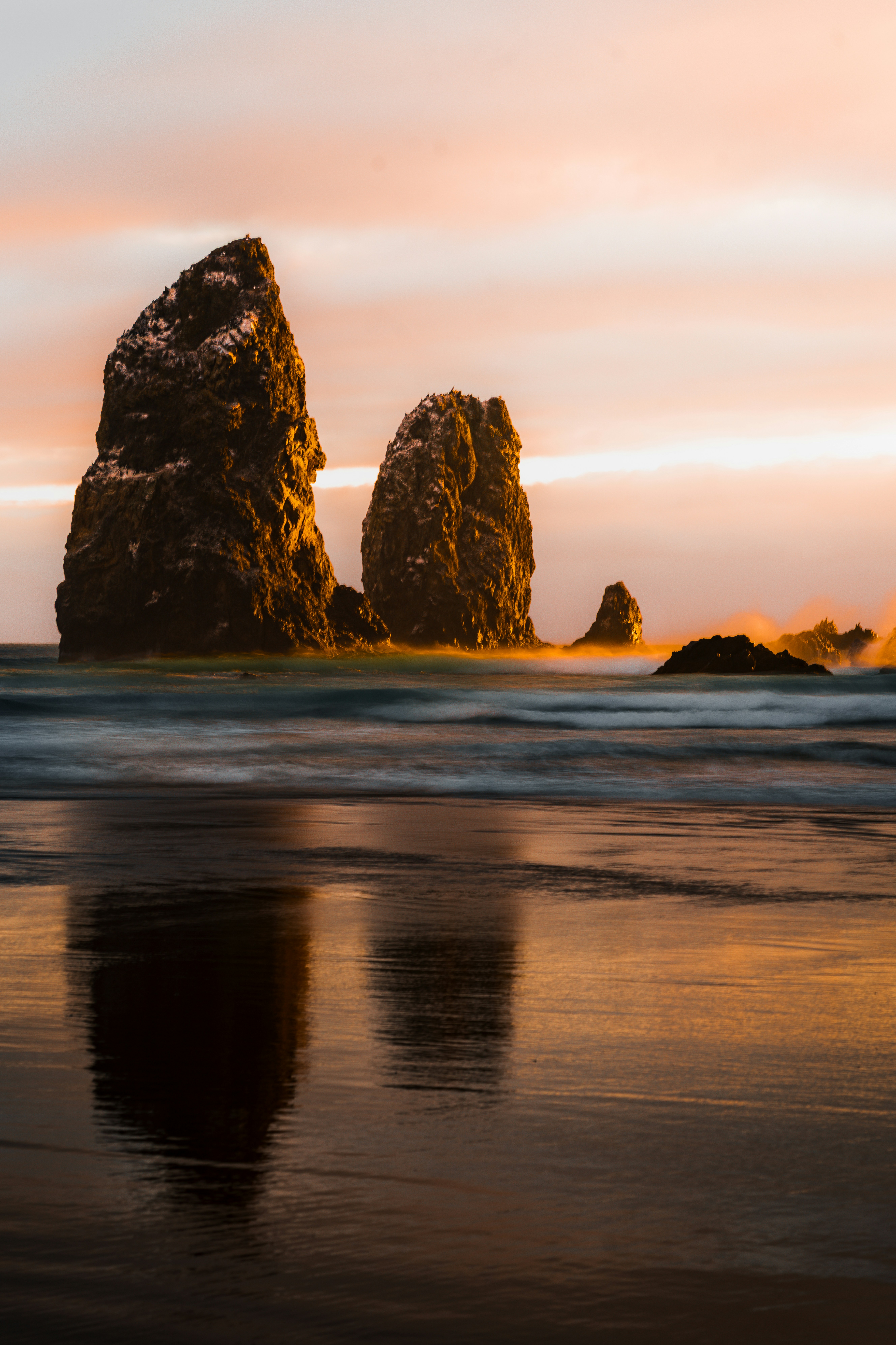 Sunlit Sea Stacks: Echoes of Light Over Quiet Tides