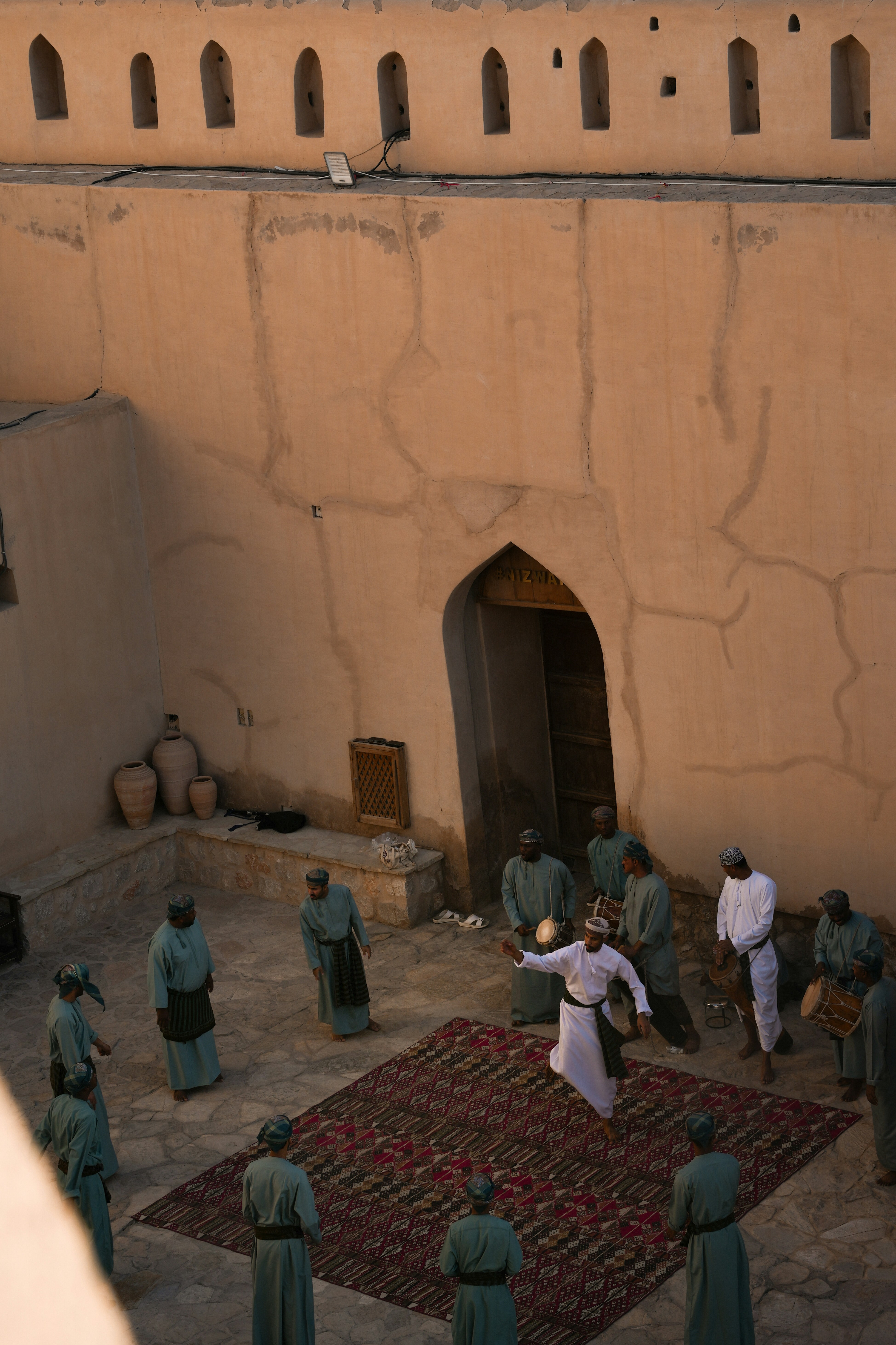 Ceremonial Dance in the Courtyard of a Dignified Adobe Fort