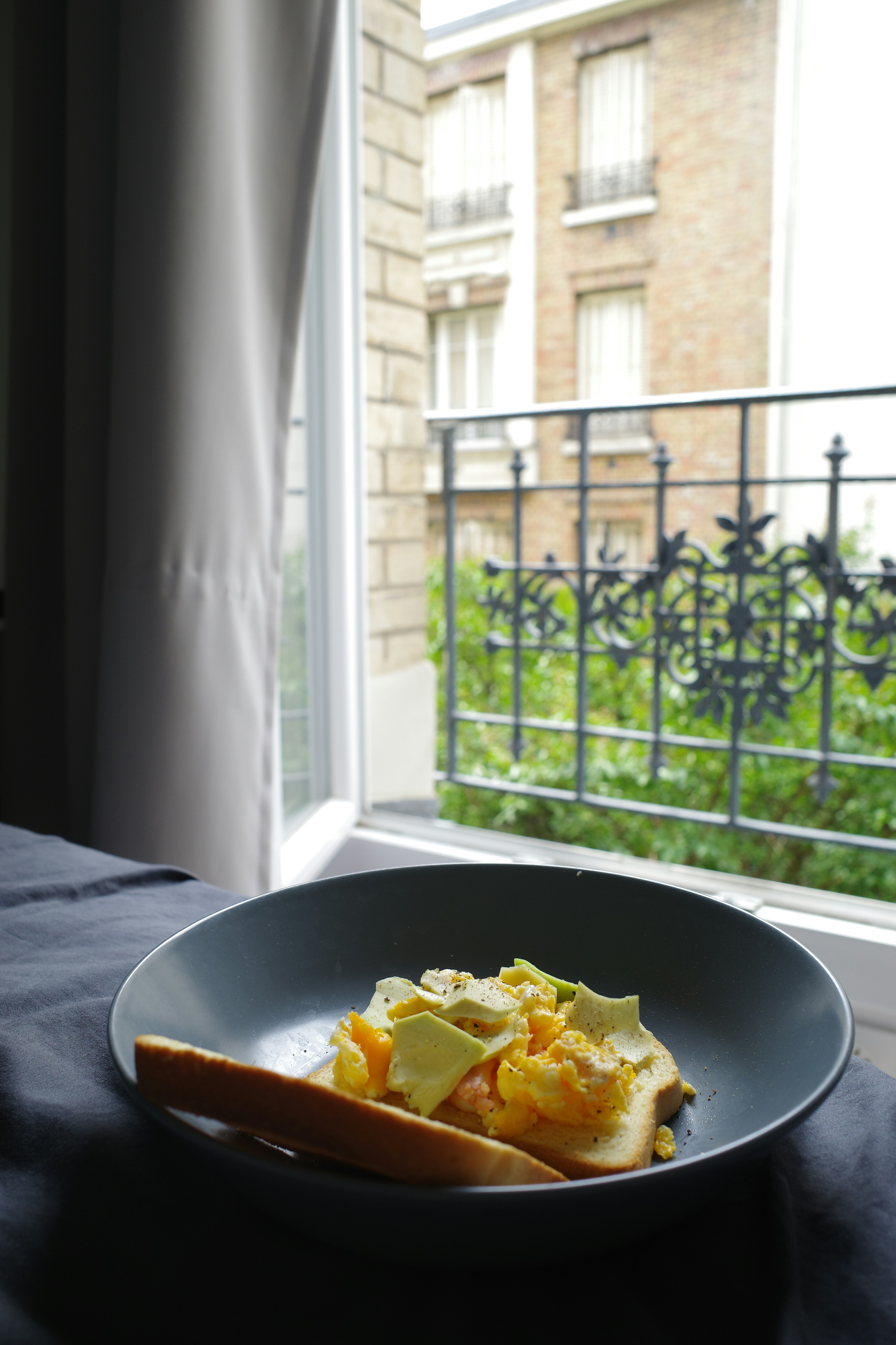 Breakfast by the Window: A Plate of Toast and Scrambled Eggs in Quiet Morning Light