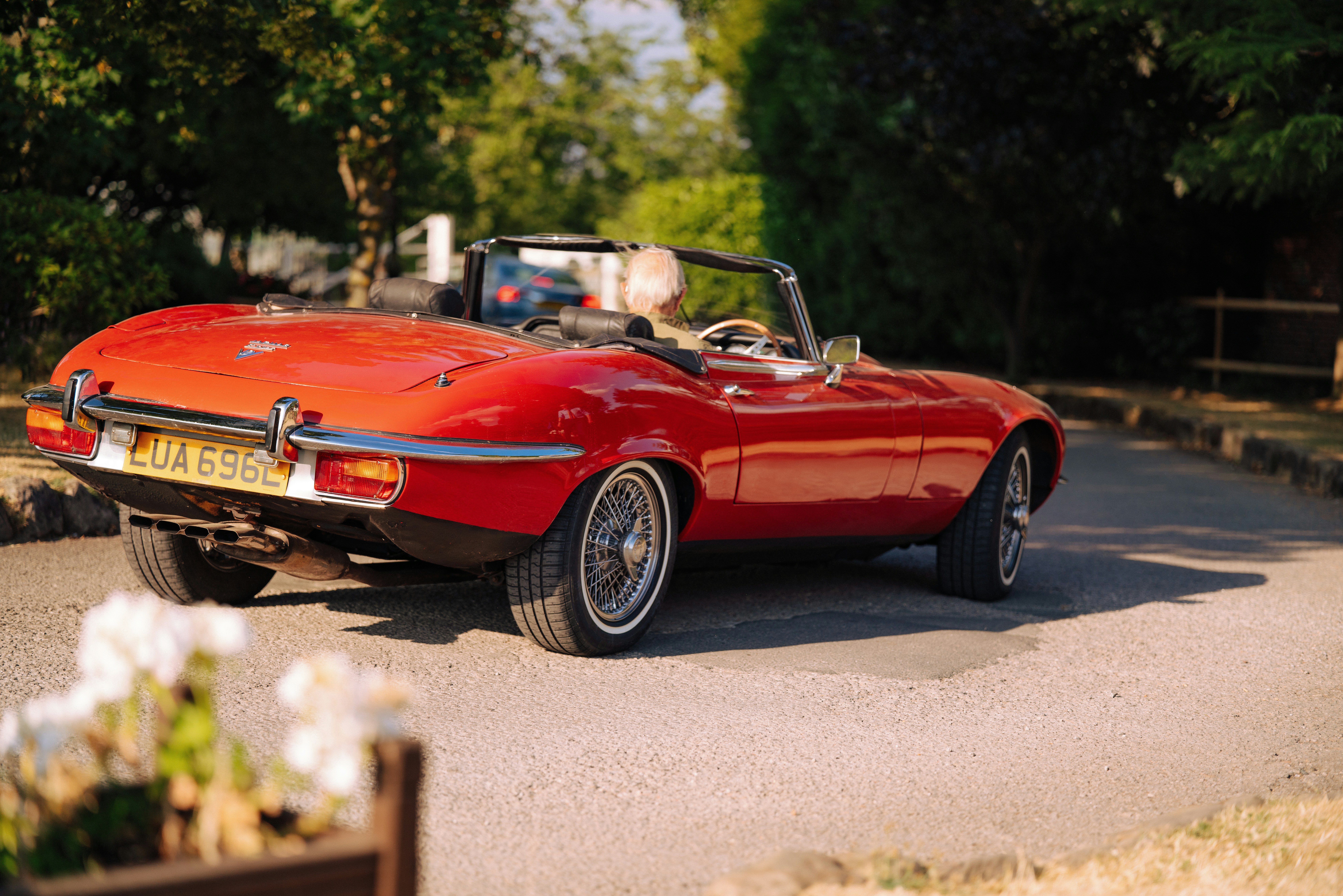 Red Convertible at Rest: Classic Curves Under a Summer Sun
