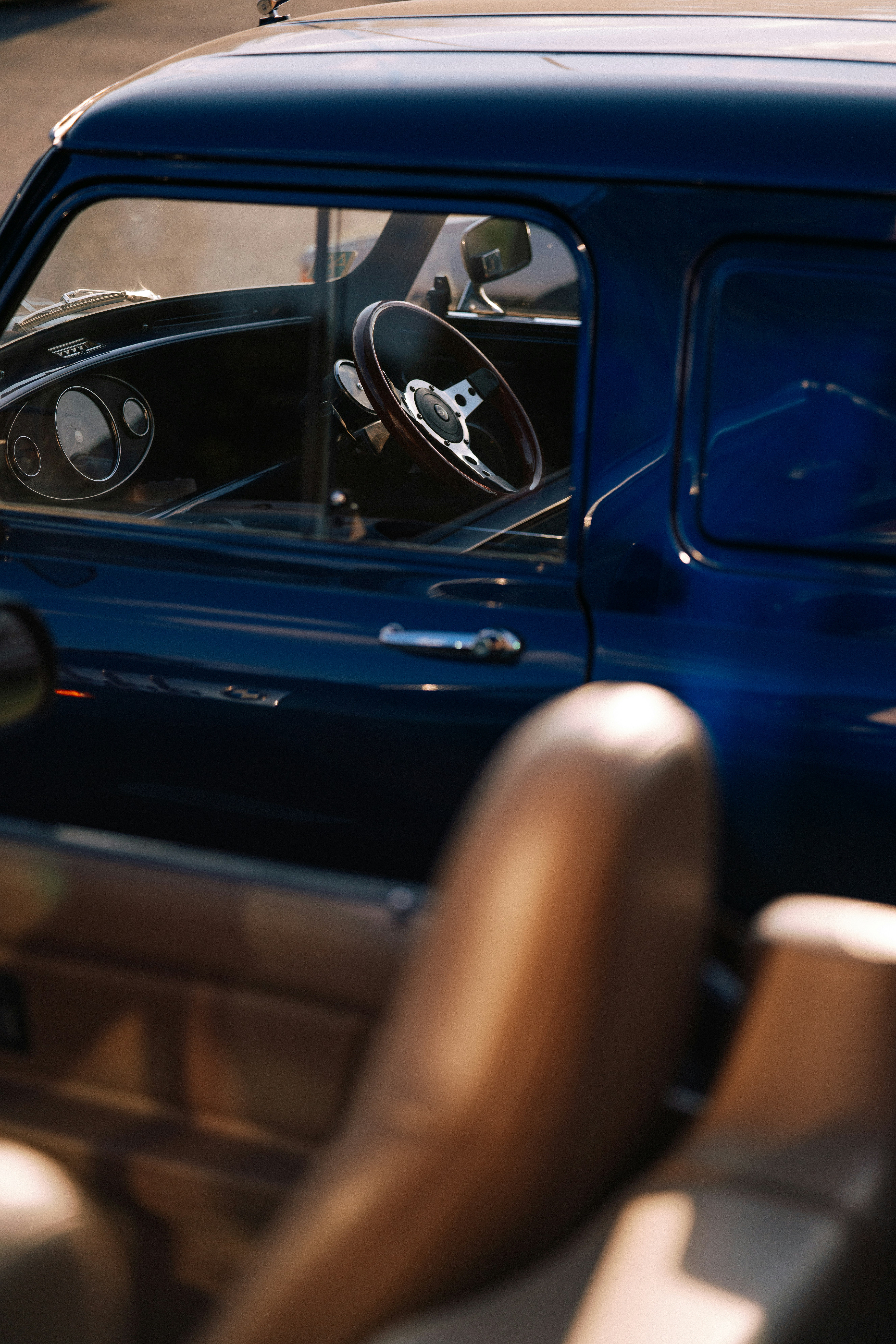 Blue vintage cockpit: steering wheel and interior glow
