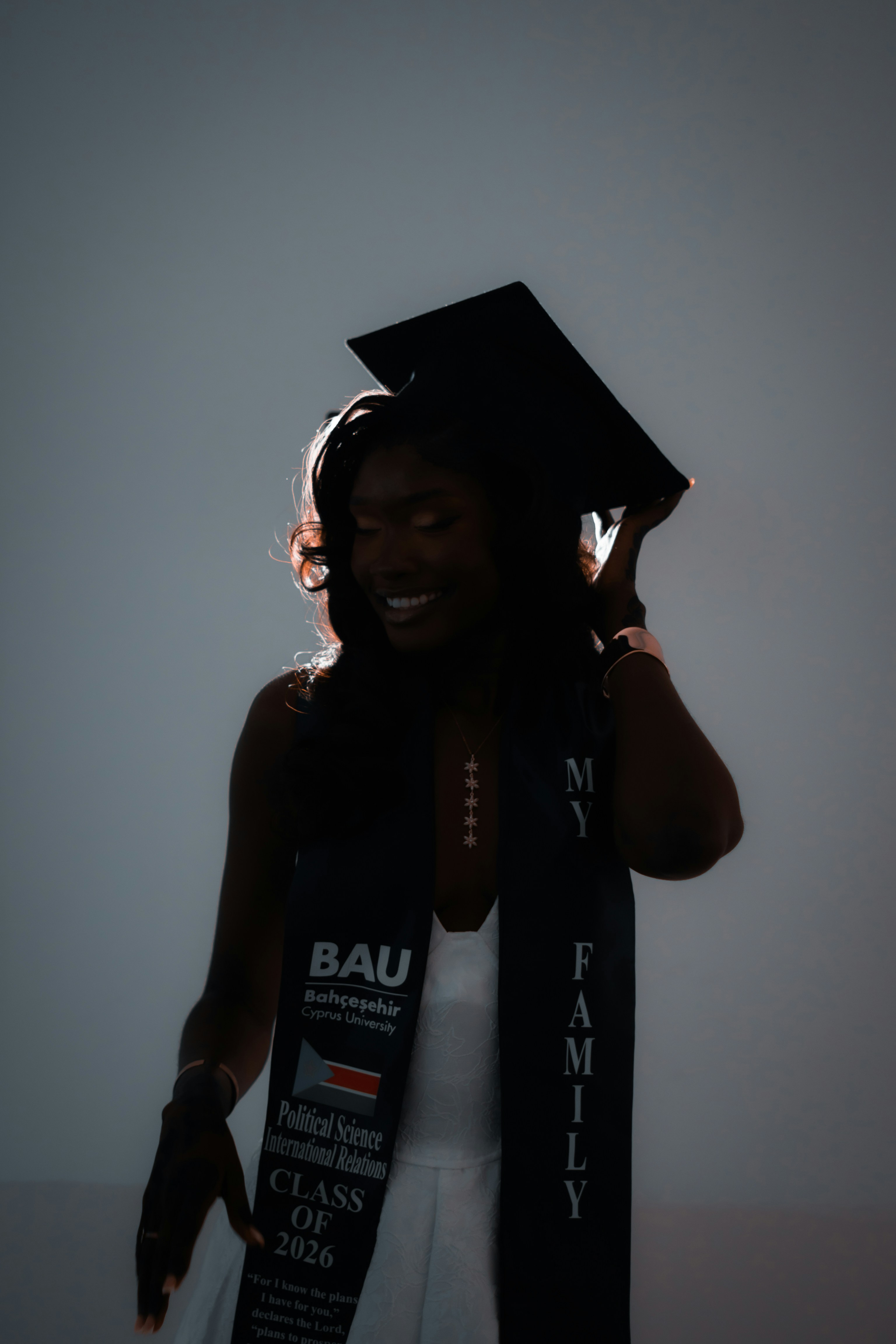 Graduation Glow: Silhouette of Hope in a Dusk-Hued Moment